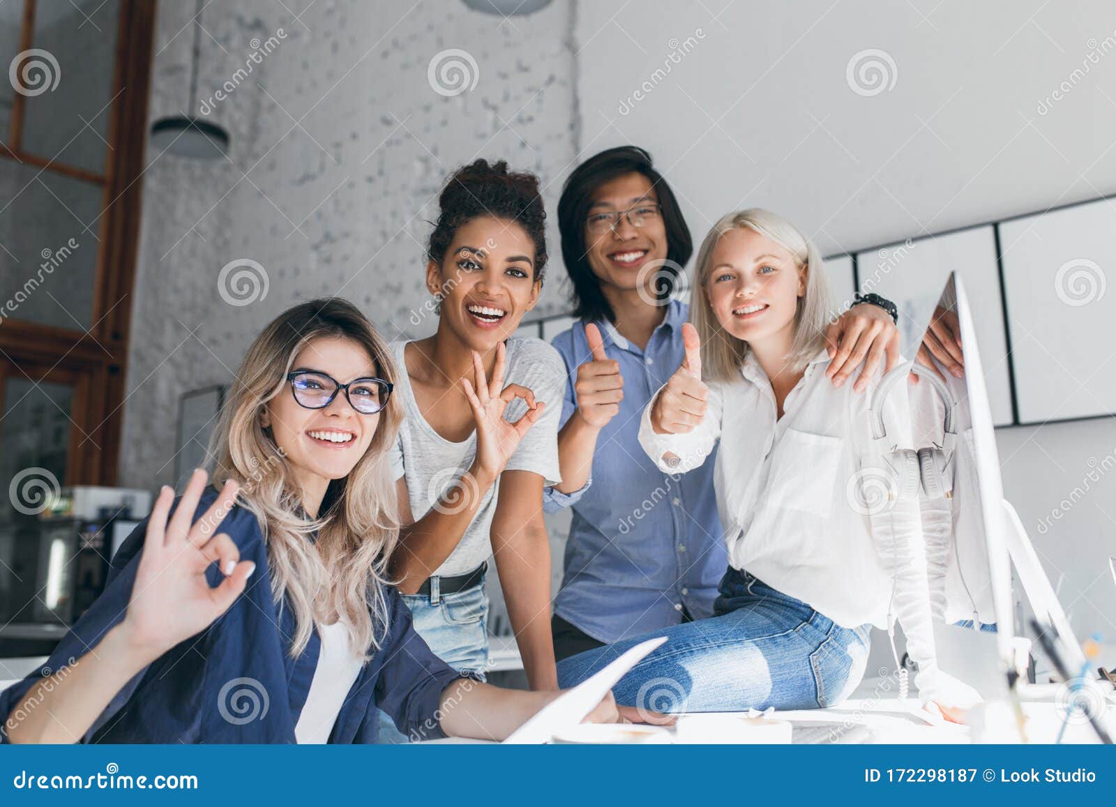 Team of Young Freelance Specialists Having Fun in Office and Laughing ...