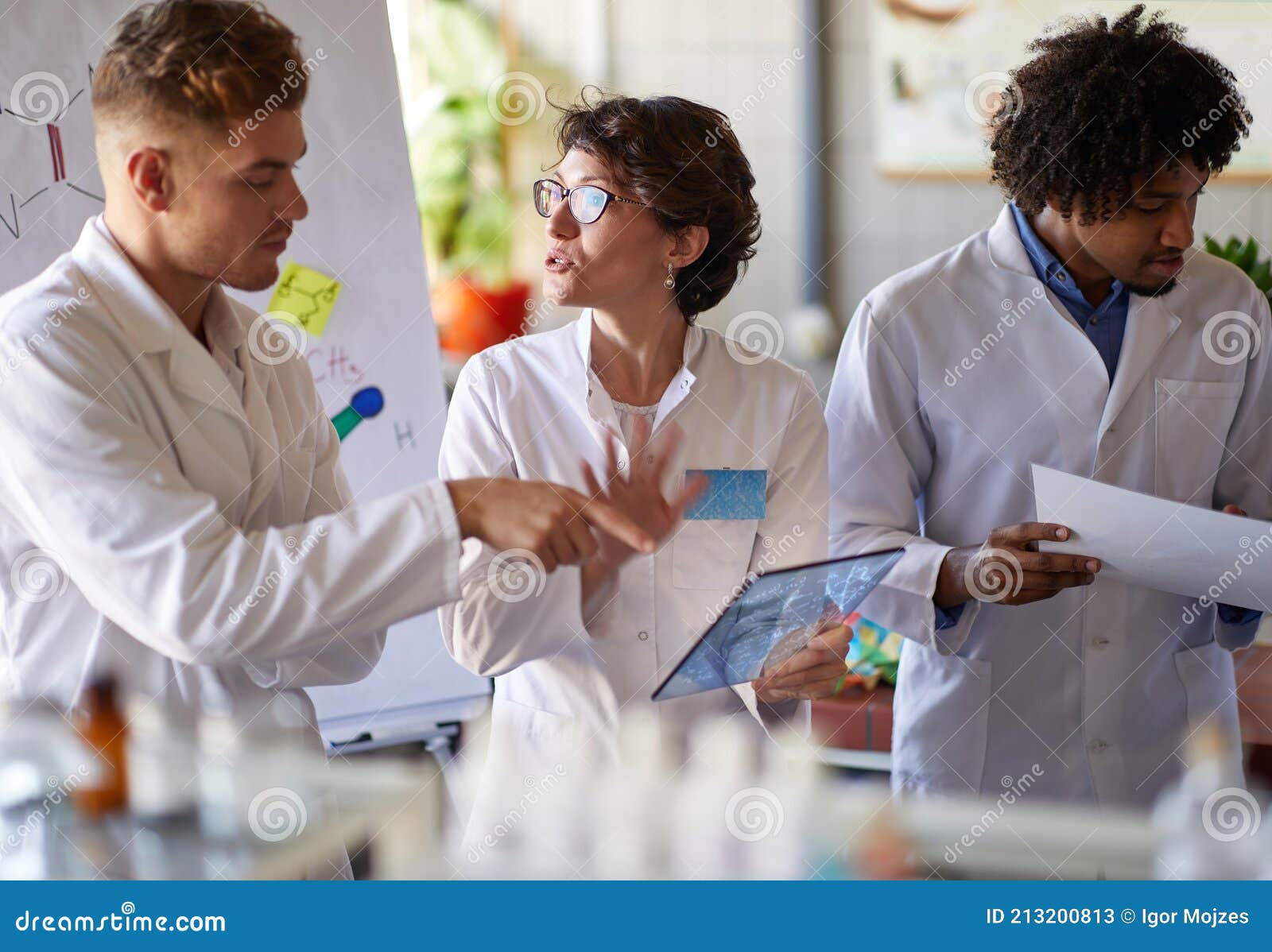 Team of Young Laboratory Technicians Discussing Test Results Stock ...