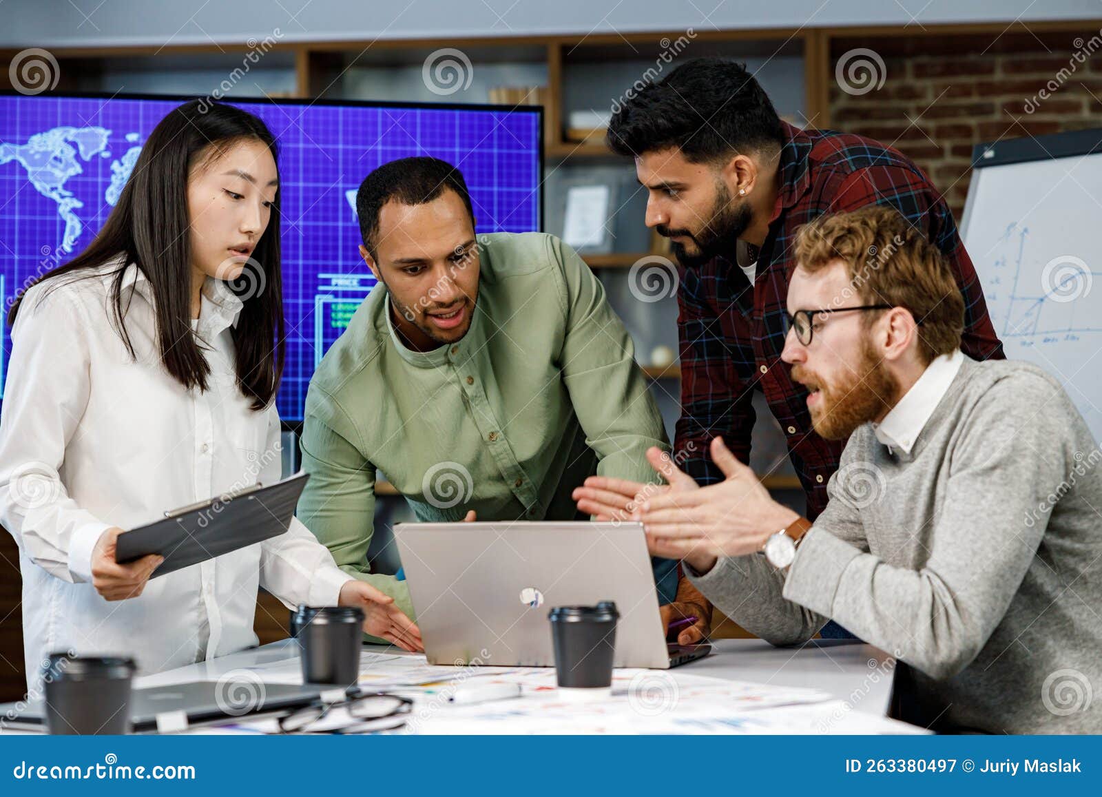 A Team of Young Multinational Business People are Working on a Startup ...