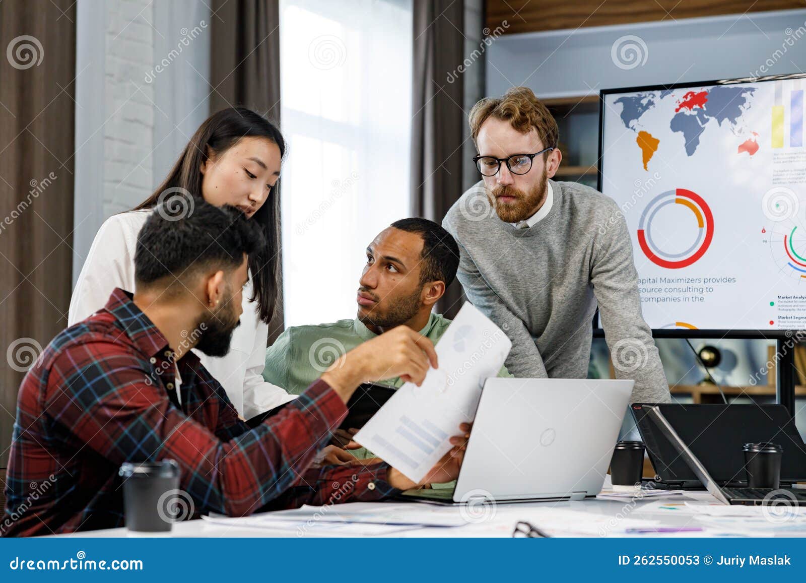 A Team of Young Multinational Business People are Working on a Startup ...