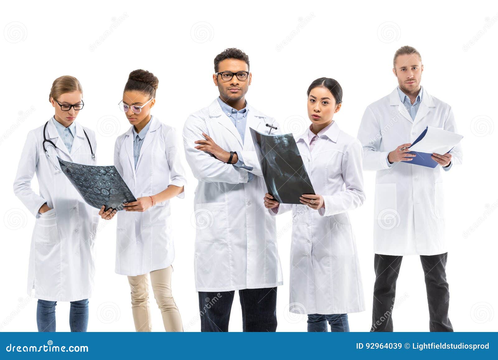 Team of Young Professional Doctors in White Coats Standing Together ...
