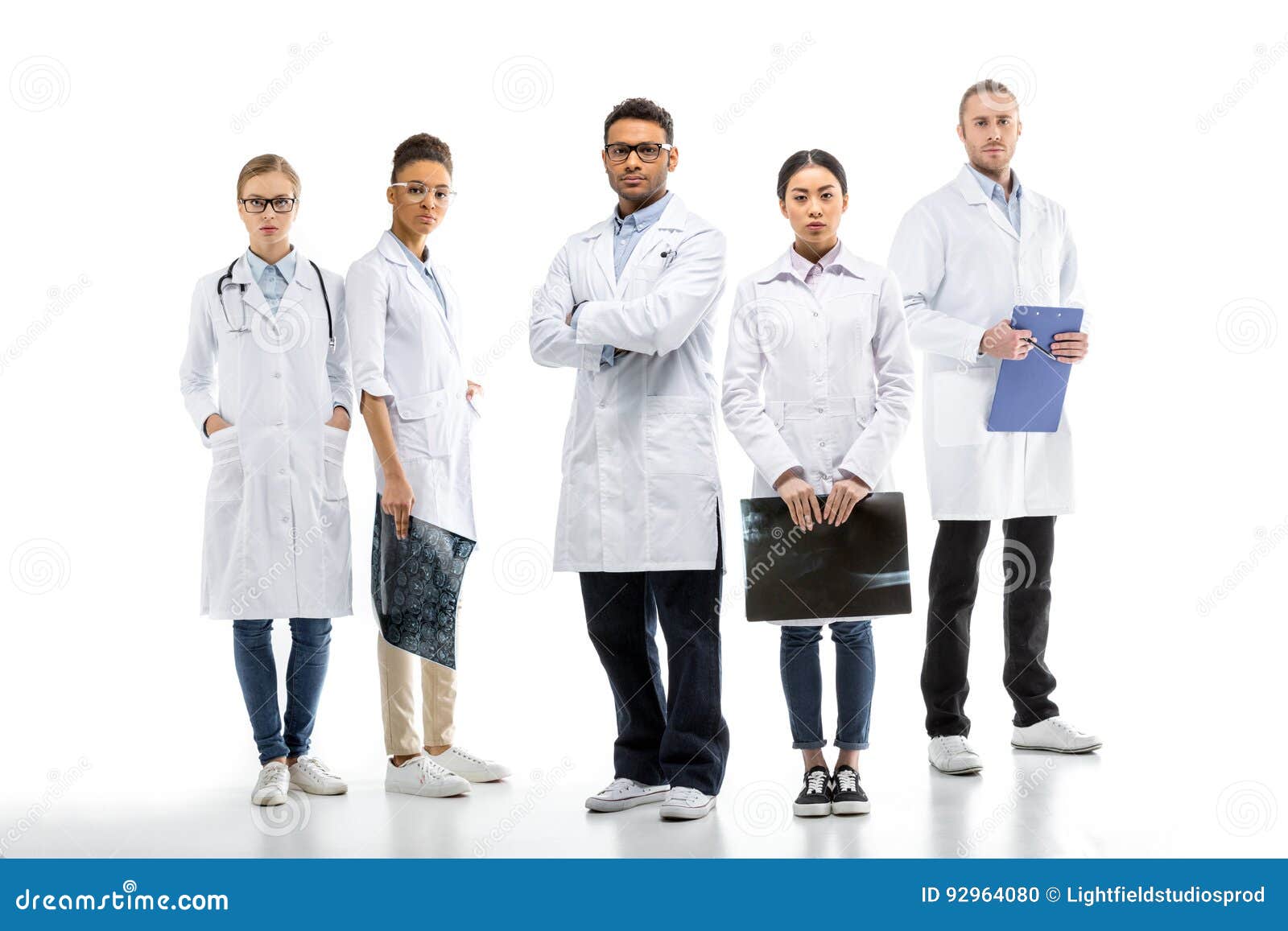Team of Young Professional Doctors in White Coats Standing Together ...