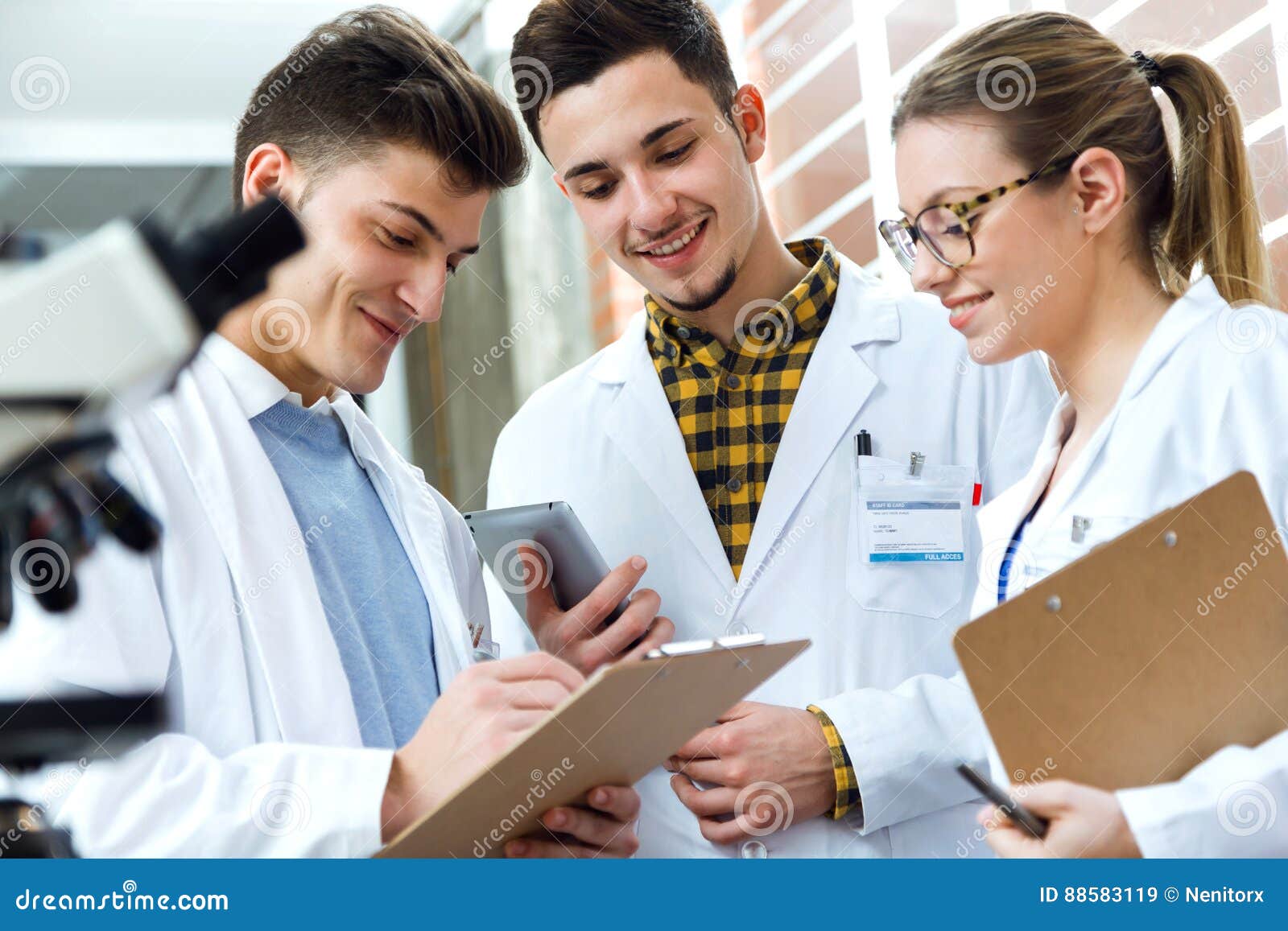 Team of Young Professional Scientists Working in Laboratory. Stock ...