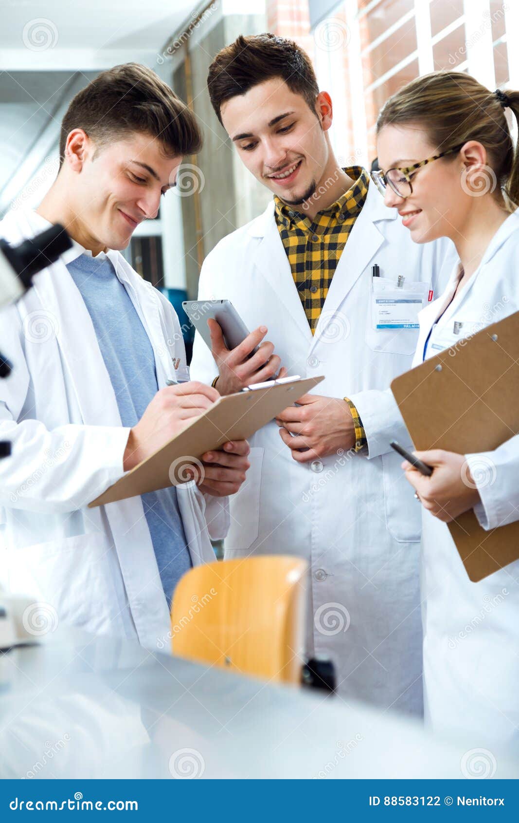 Team of Young Professional Scientists Working in Laboratory. Stock ...