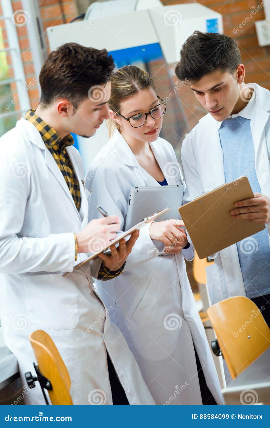 Team of Young Professional Scientists Working in Laboratory. Stock ...