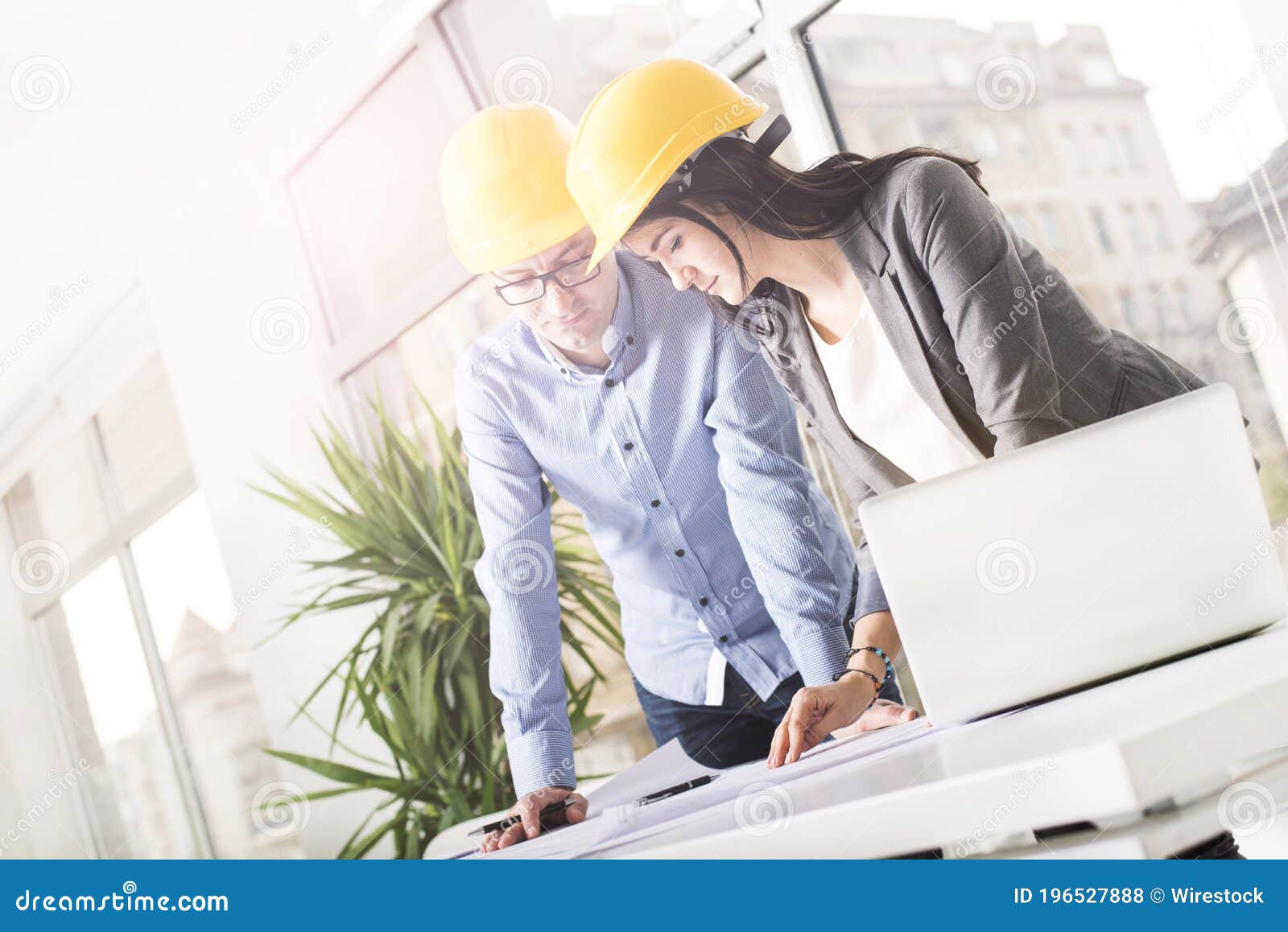 Team of Young Successful Architects Looking Down and Analyzing Their ...