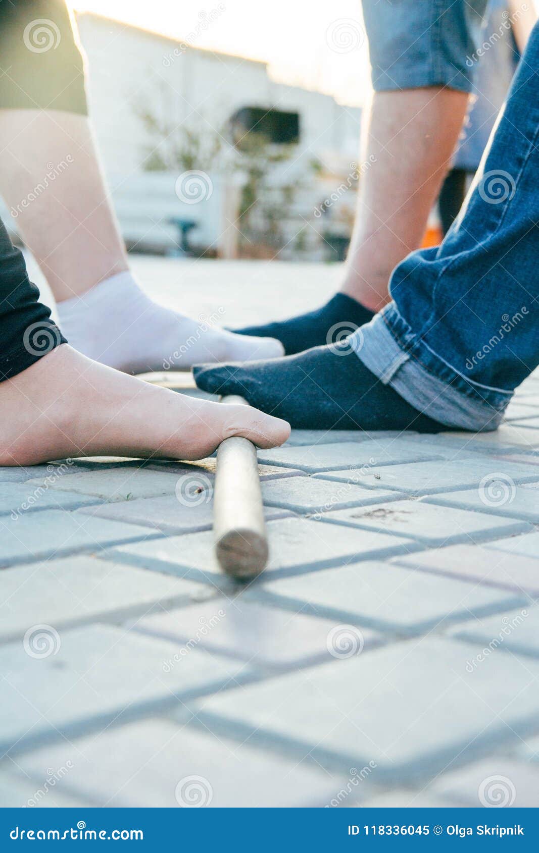 Teambuilding Activity with a Stick and Feet. Collective Support and ...