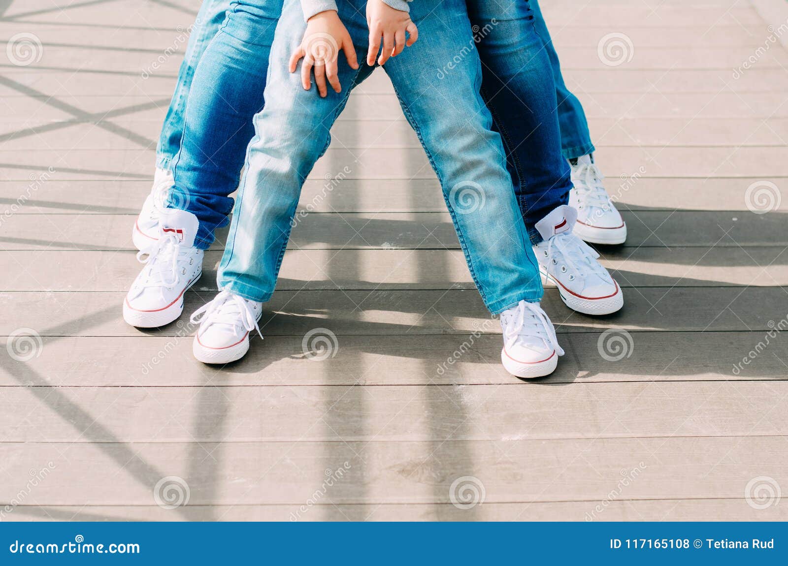 Teambuilding, Three Pairs of Legs in the Same Shoes and Jeans on Stock ...