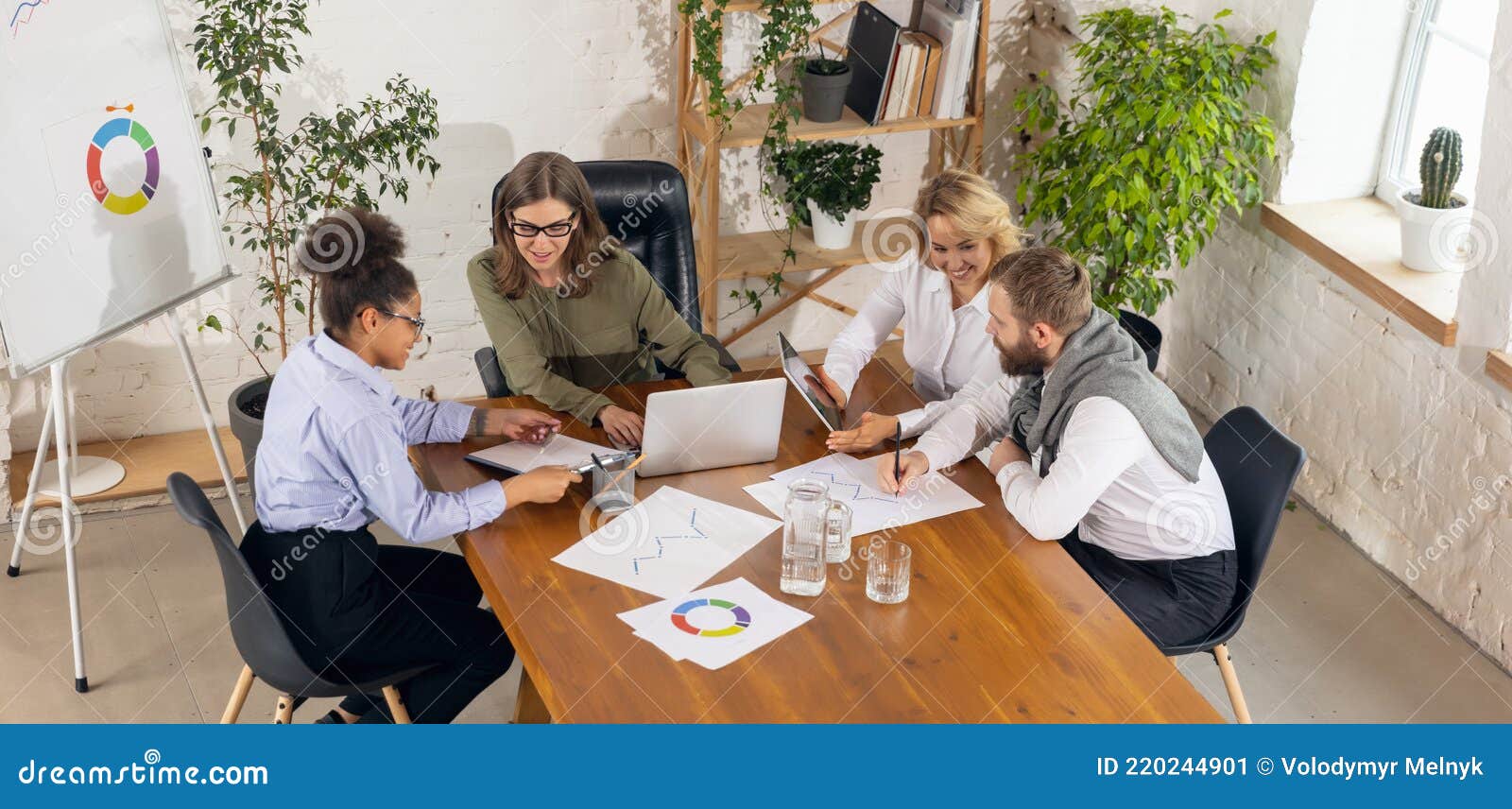 Colleagues Working Together in Modern Office Using Devices and Gadgets ...