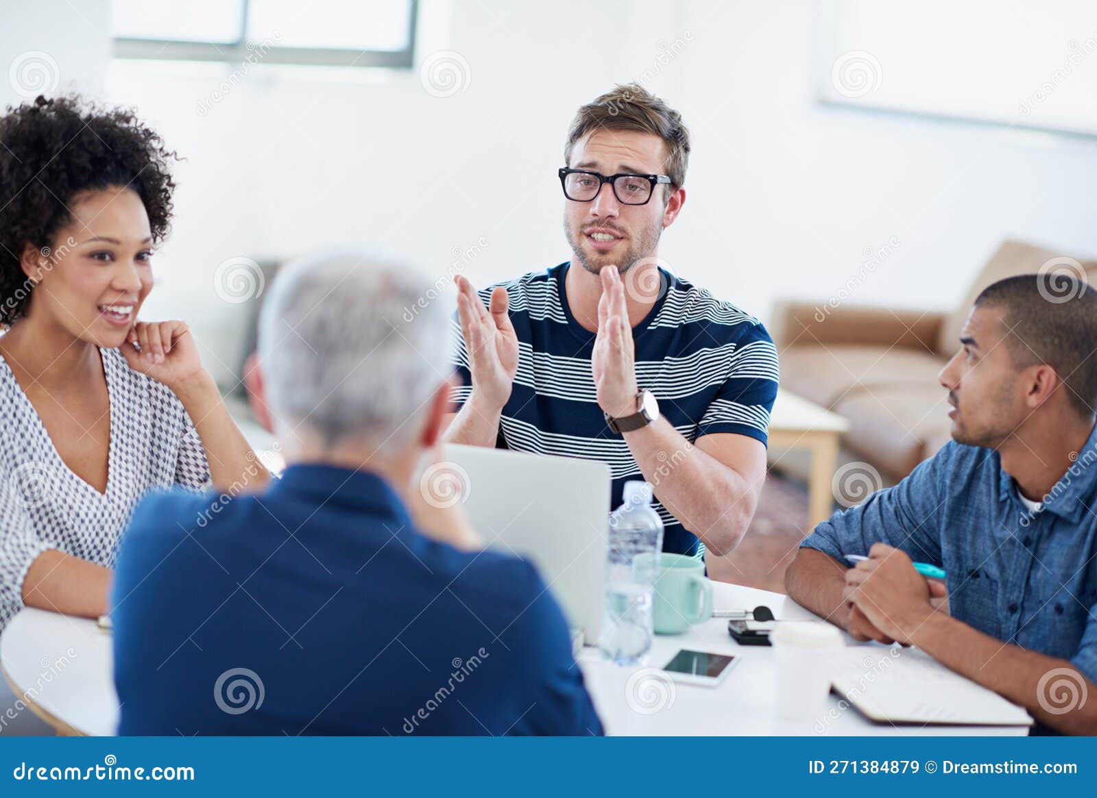 Teamwork in Action. a Group of Designers at Work in an Office. Stock ...