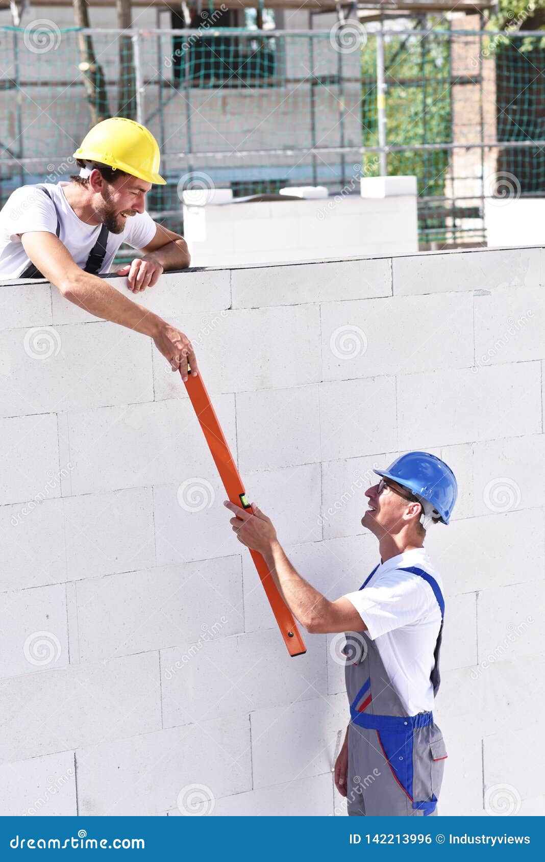 Teamwork on the Building Site - Construction Workers Build a Family ...