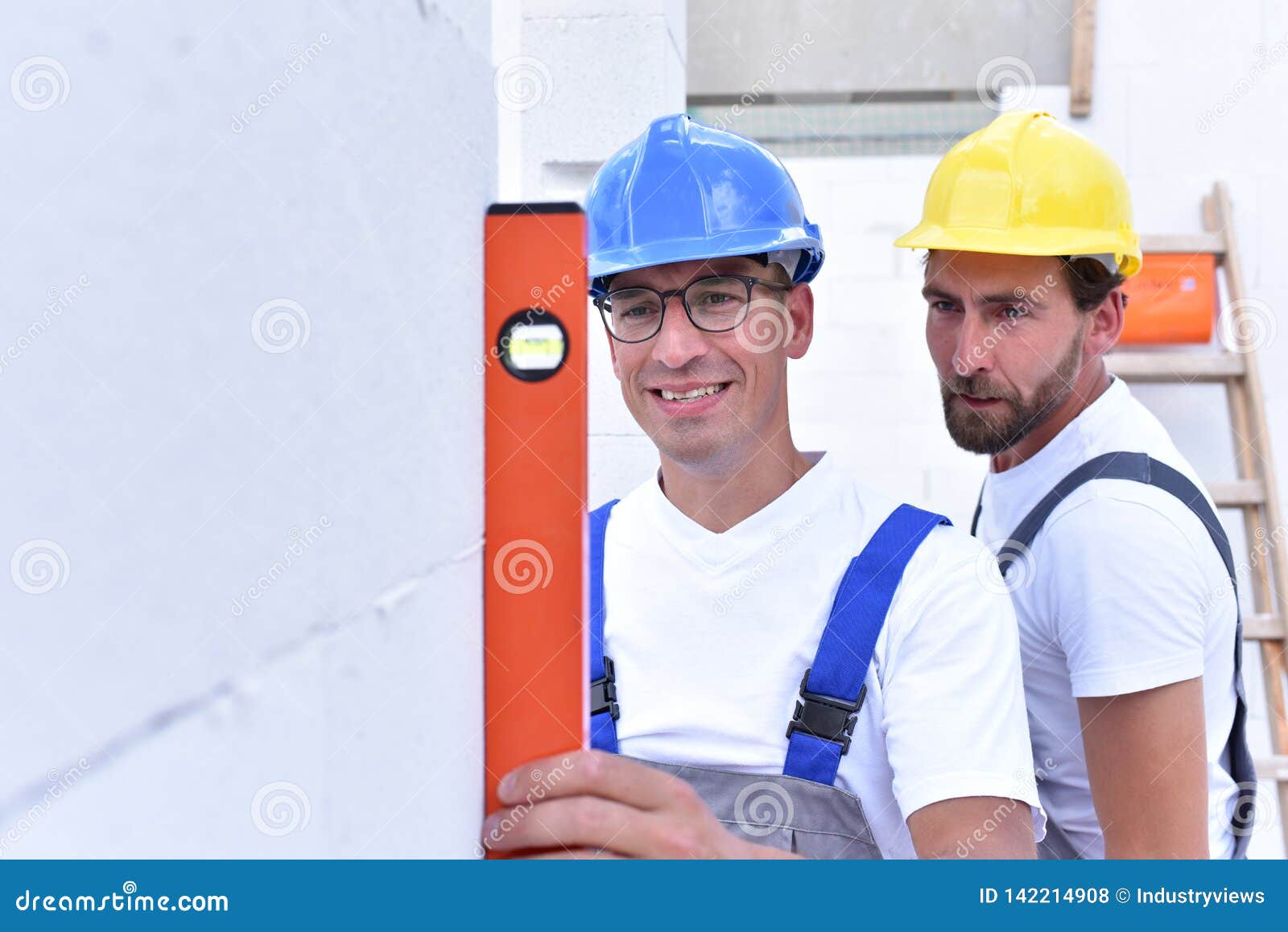 Teamwork on the Building Site - Construction Workers Build a Family ...