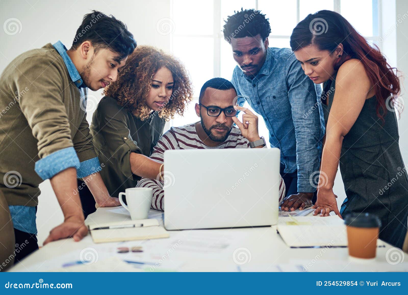 Teamwork Can Solve almost Any Problem. a Group of Colleagues Using a ...