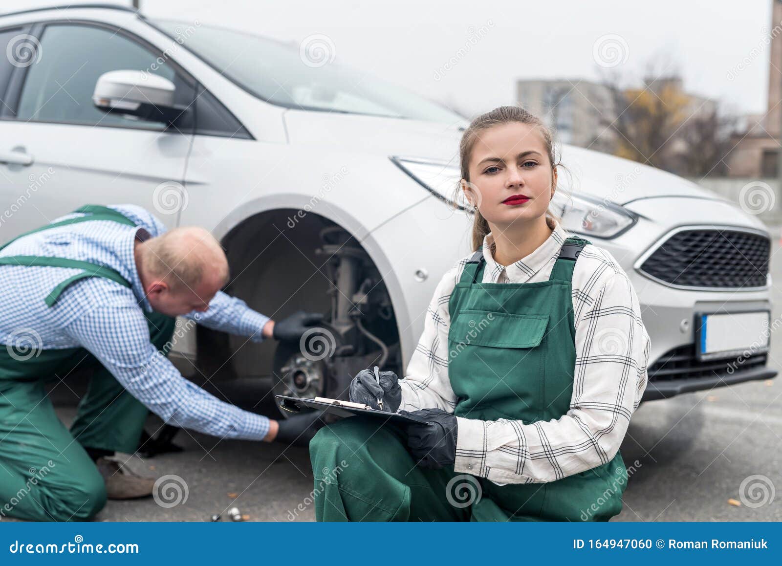 Teamwork on Car Service Station, Brake Disk Checking Stock Photo ...