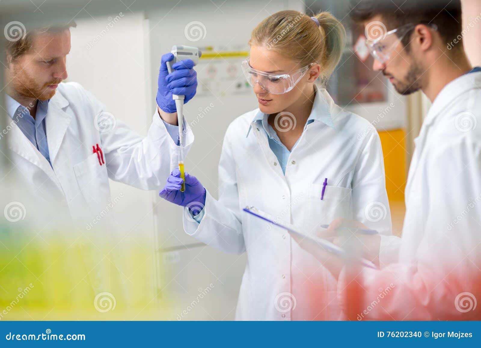 Teamwork in Chemical Lab Put Sample of Liquid in Test Pipette Stock ...