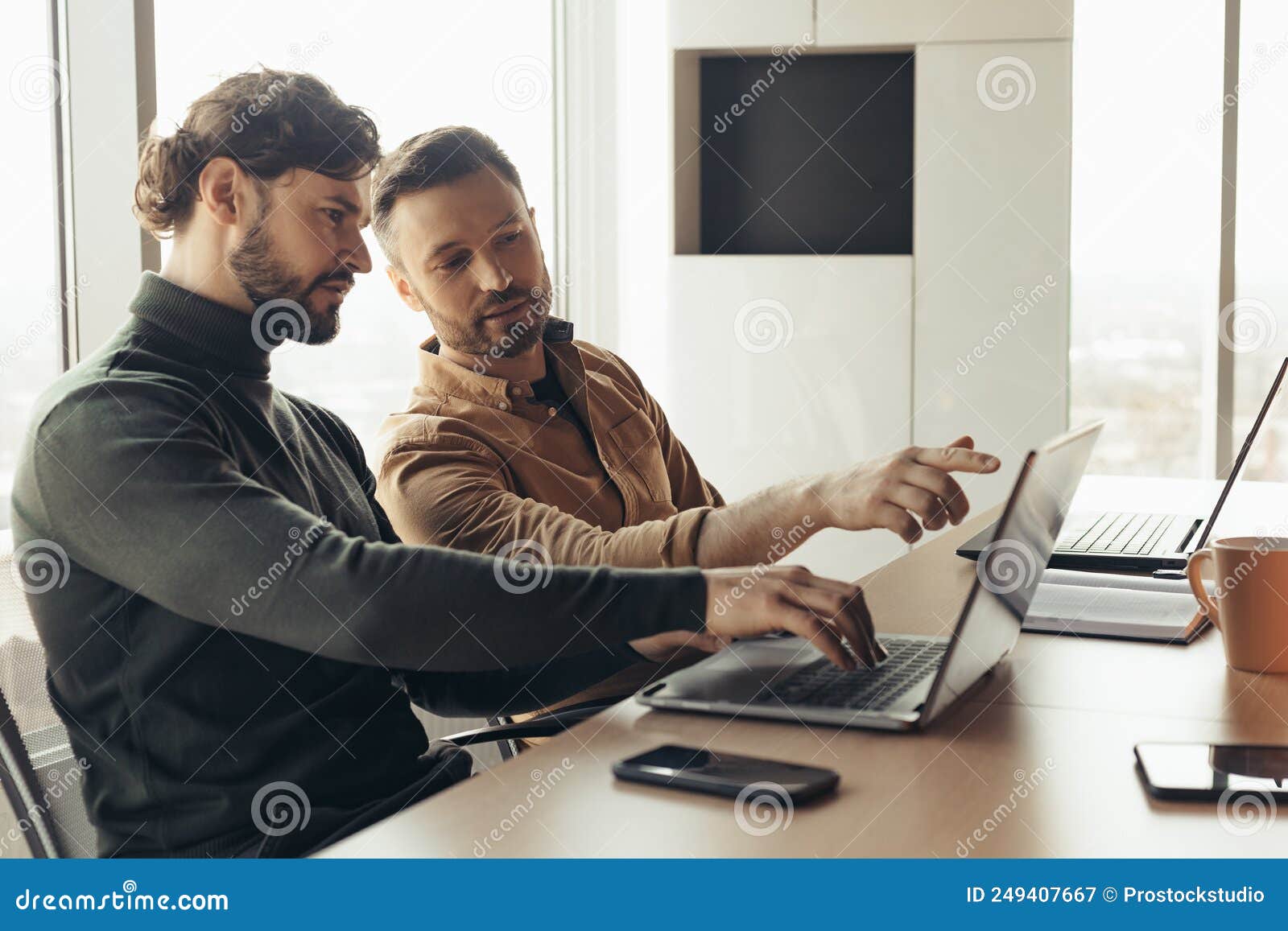 Teamwork and Collaboration. Male Coworkers Communicating, Using Laptop ...