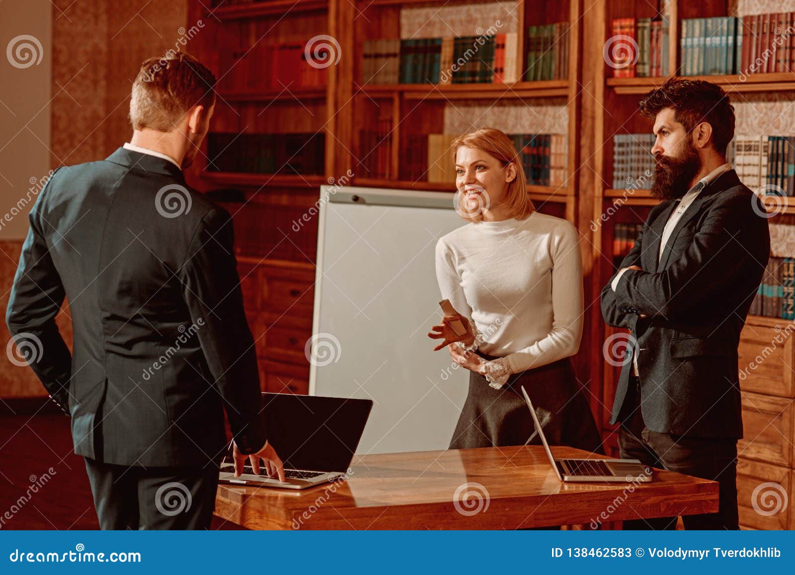 Teamwork Concept. Group of Students Training Teamwork Skills in Library ...