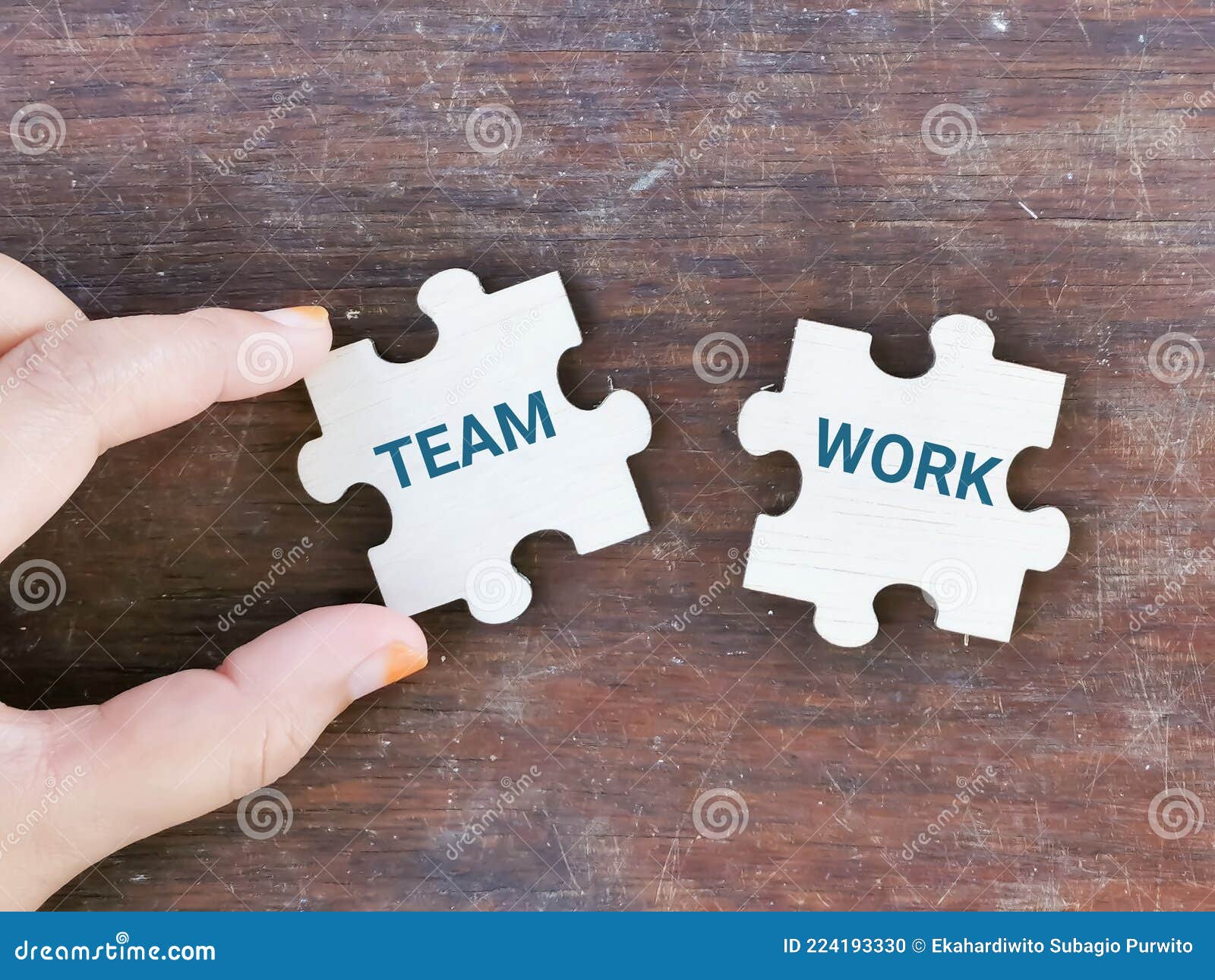 Phrase Teamwork Written on Jigsaw Puzzle with Hand. Stock Photo - Image ...
