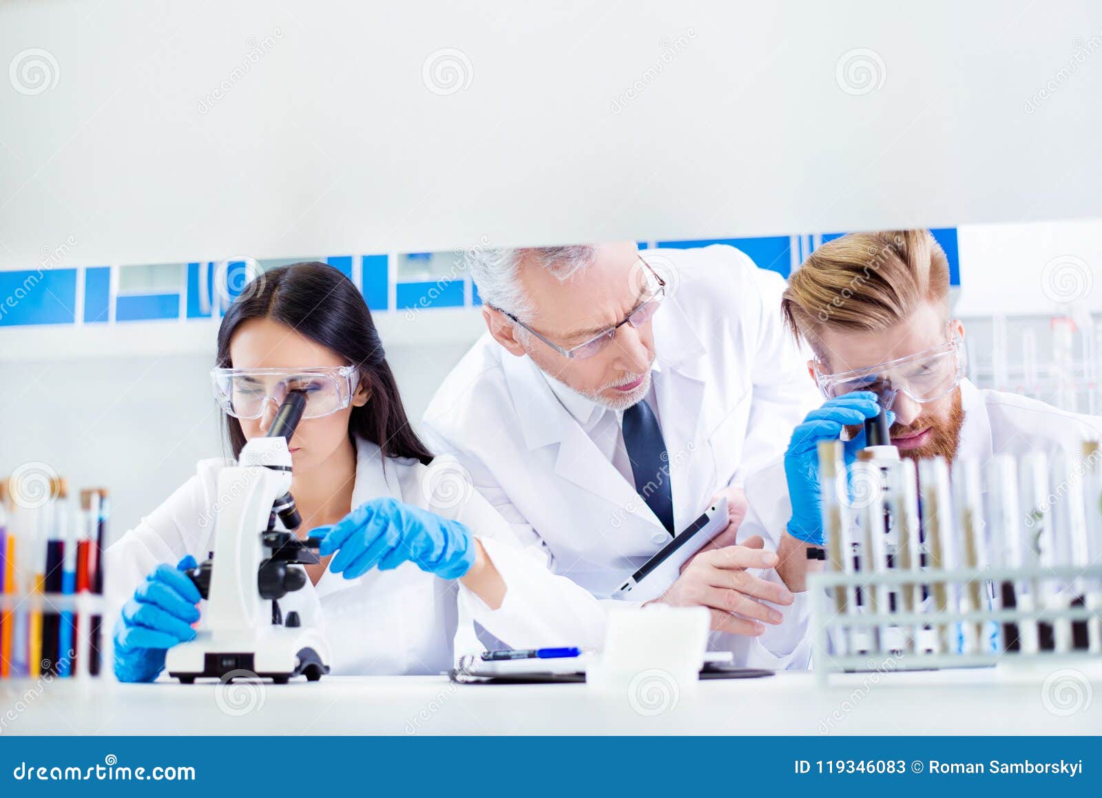 Teamwork Concept. Professor is Checking and Controlling the Group Work ...