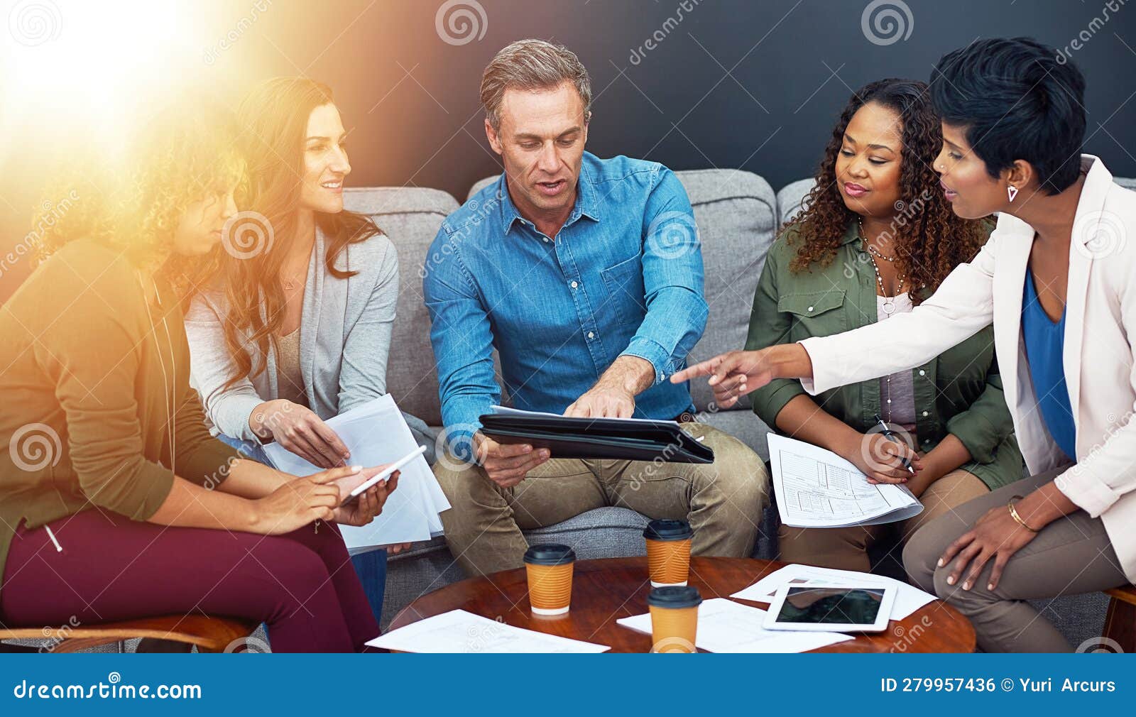 Teamwork is Essential for a Well Run Business. a Creative Team Meeting ...