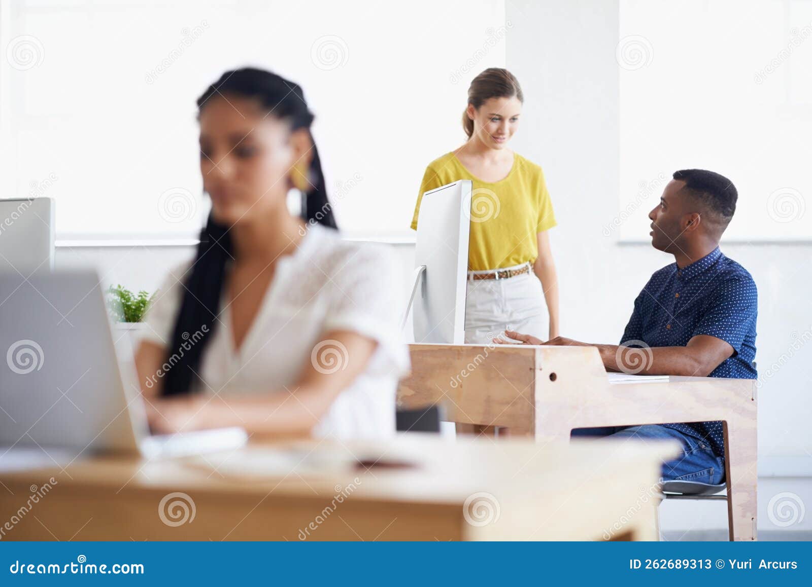 Teamwork always Gets the Job Done. a Group of Colleagues Working Around ...