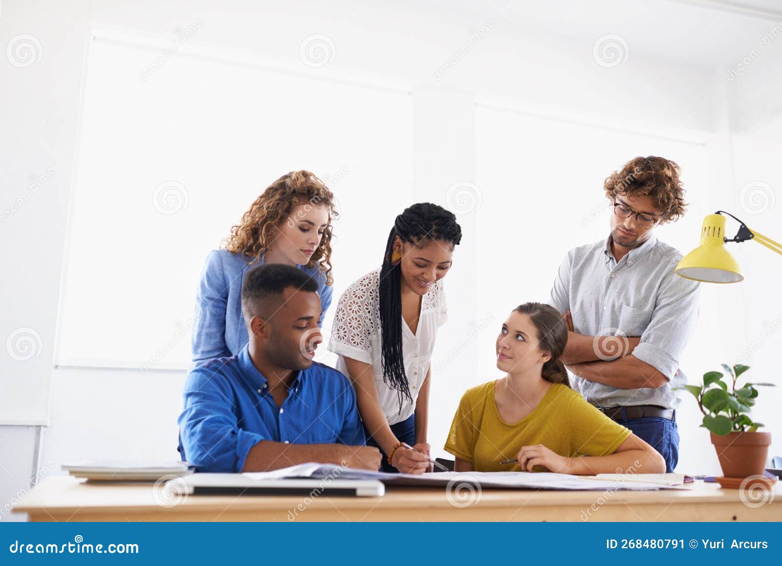 Teamwork always Gets the Job Done. a Group of Young Coworkers ...