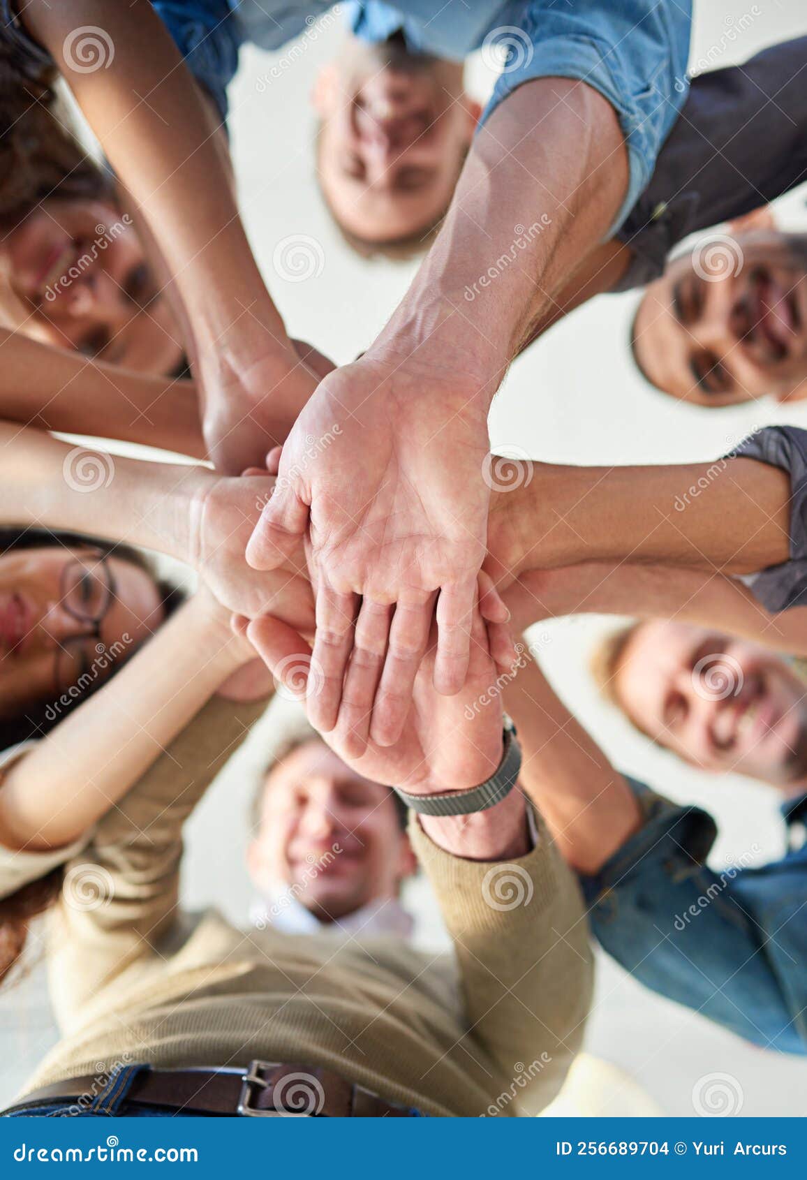 Teamwork Gets the Job Done. Low Angle Shot of a Group of Co-workers ...