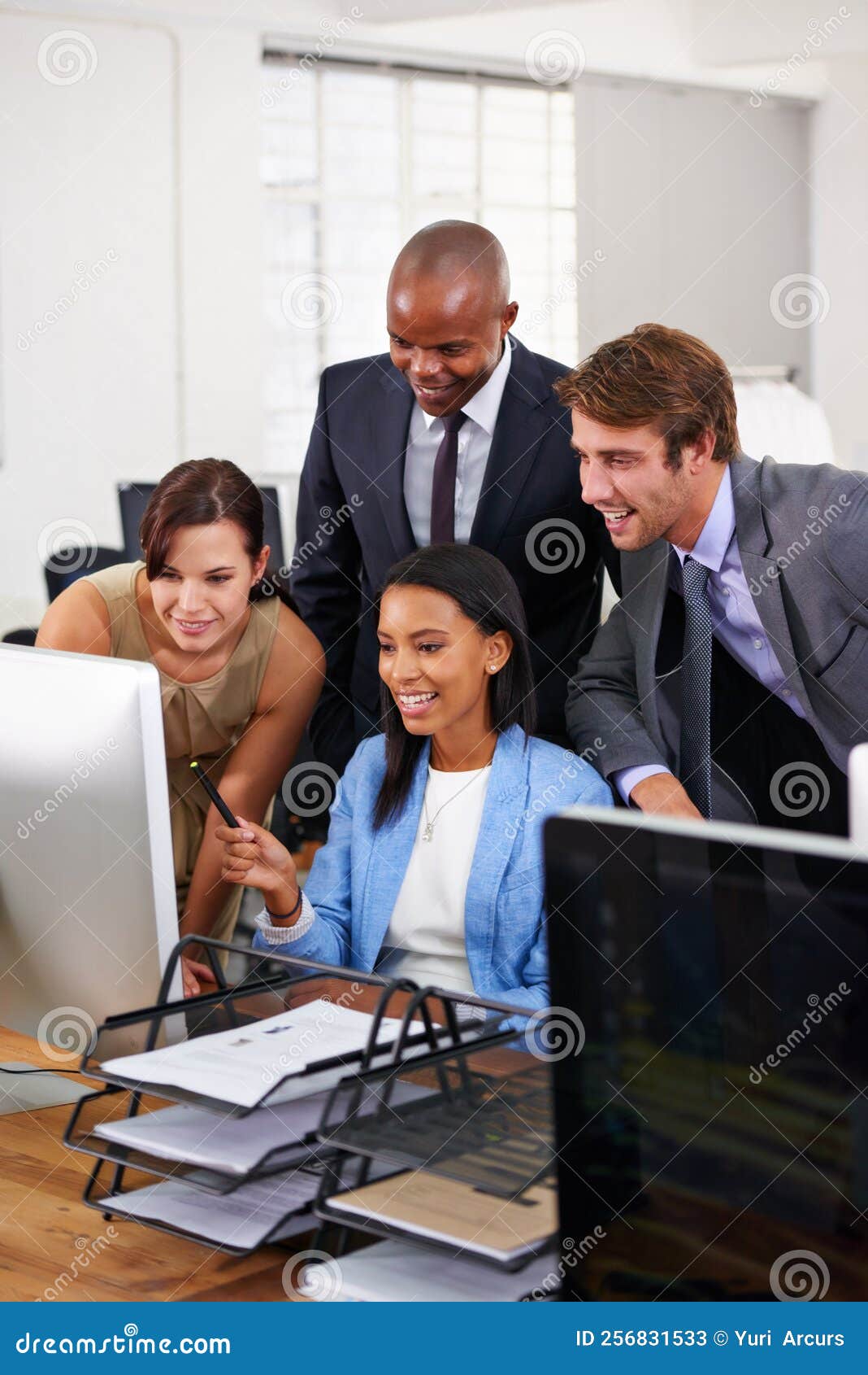 Teamwork. a Group of Businesspeople Working Around a Computer. Stock ...