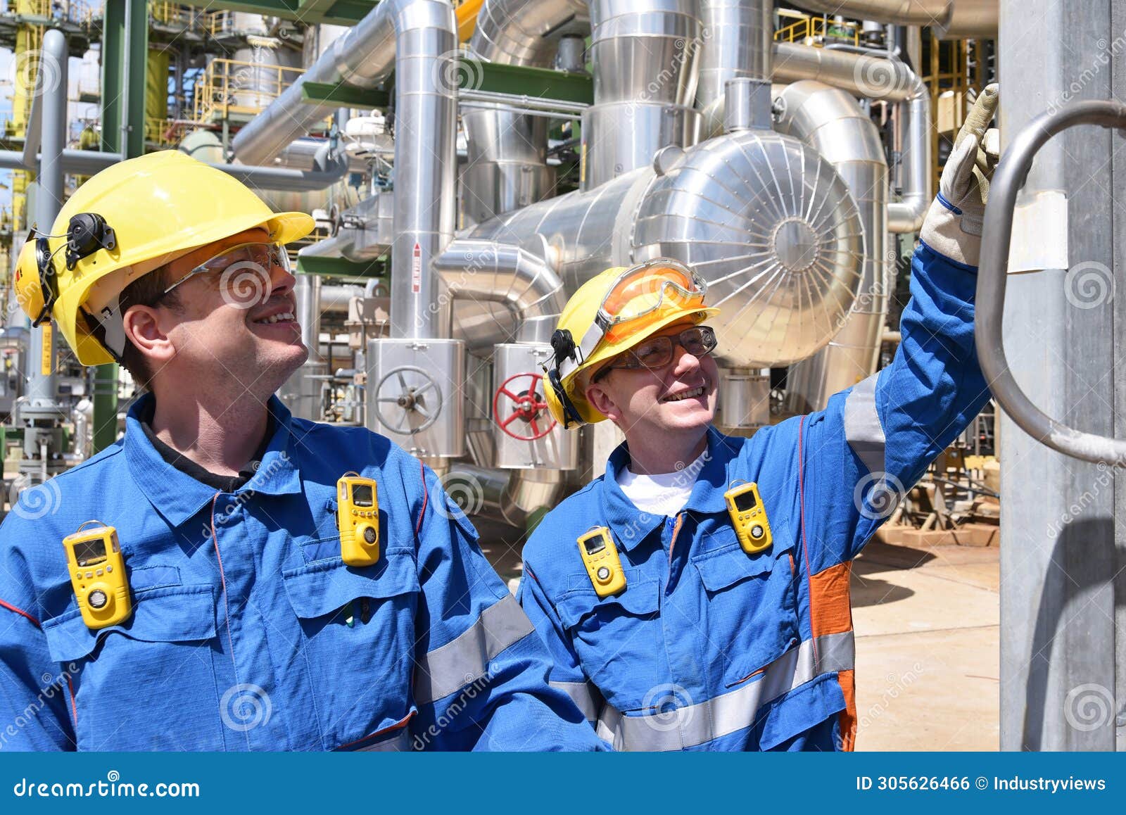 Teamwork: Group of Industrial Workers in a Refinery - Oil Processing ...