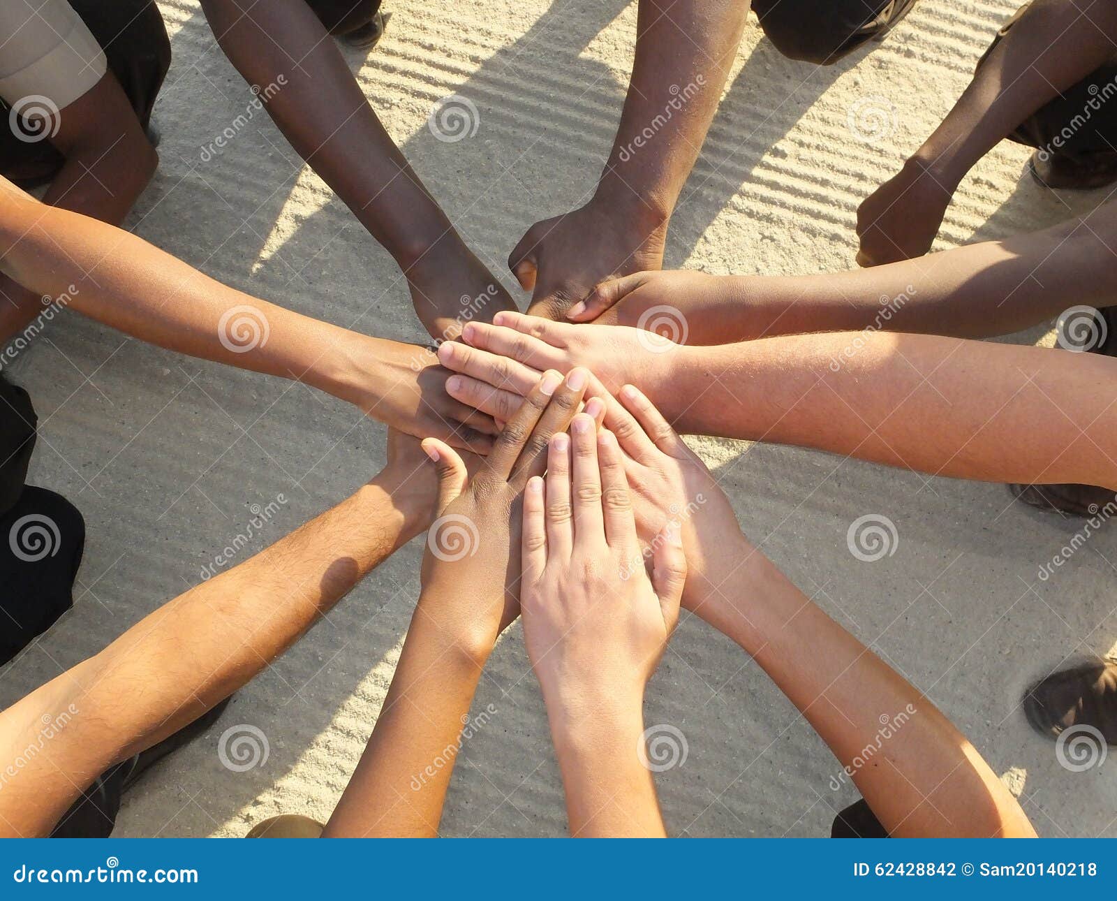 Teamwork huddle stock photo. Image of hands, angle, black - 62428842