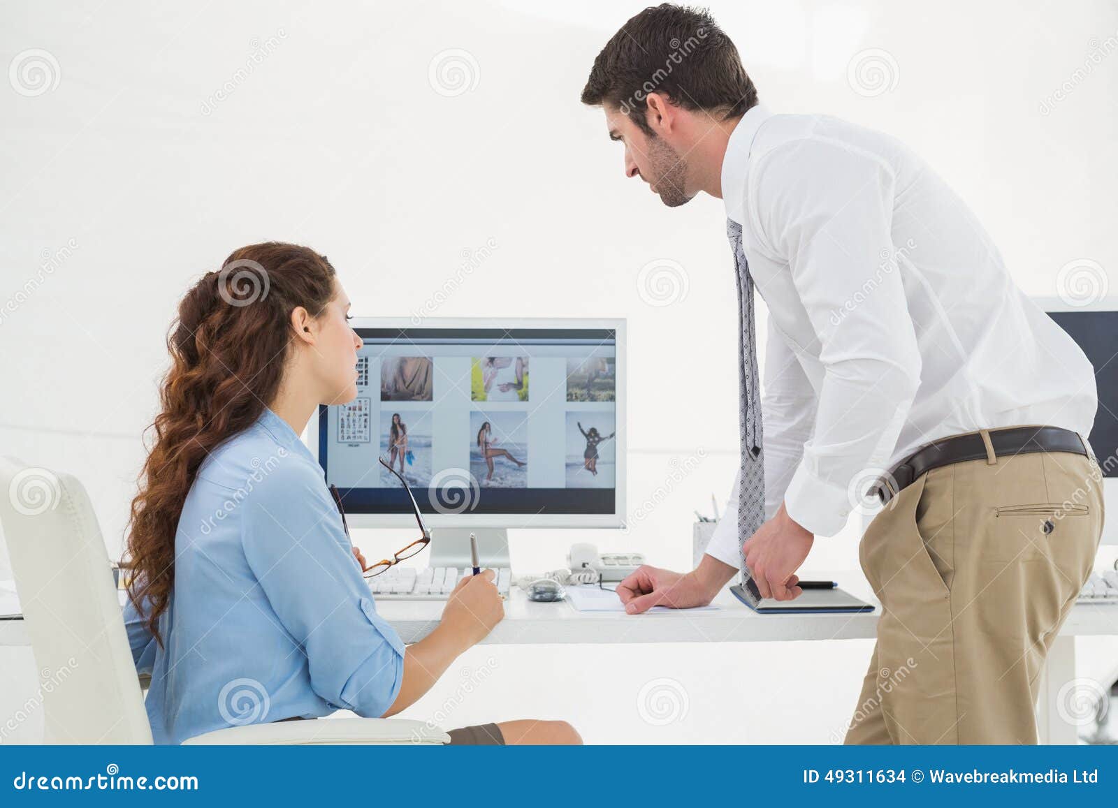 Teamwork Interacting about Photos on Computer Stock Photo - Image of ...