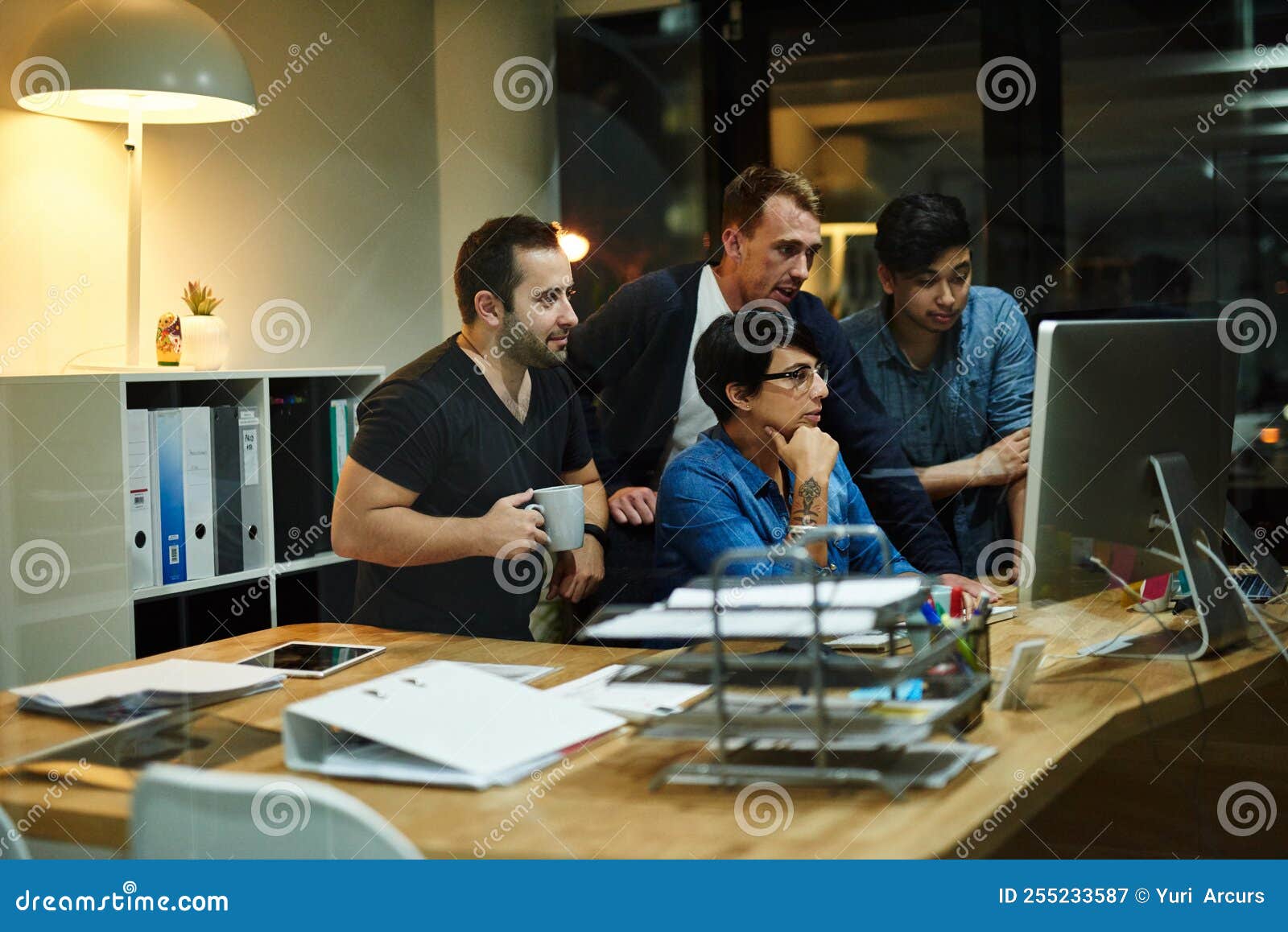 Teamwork at Its Best. Employees Working in an Office at Night. Stock ...