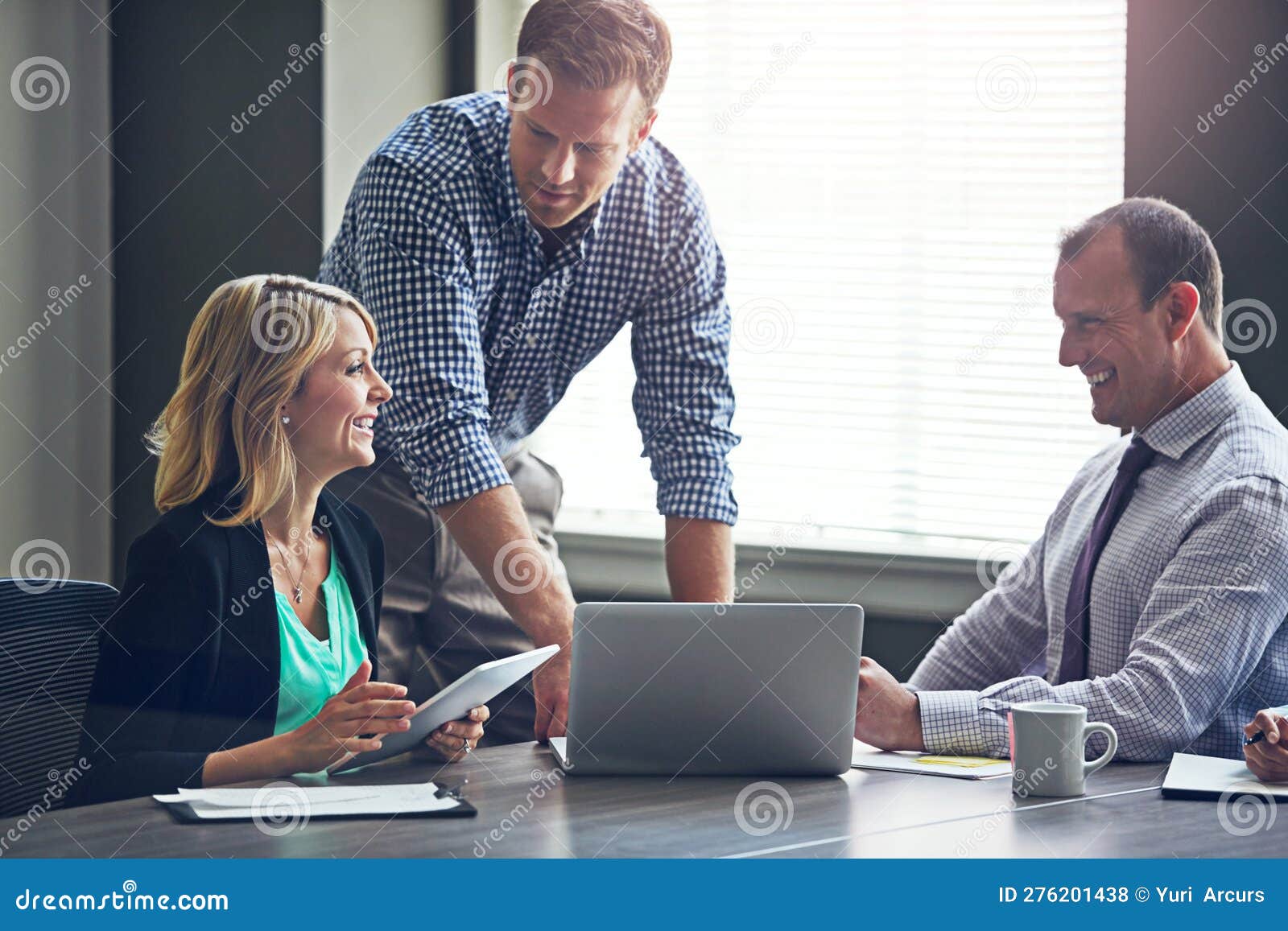 Teamwork Keeps Their Meetings on Track. a Group of Colleagues Having a ...