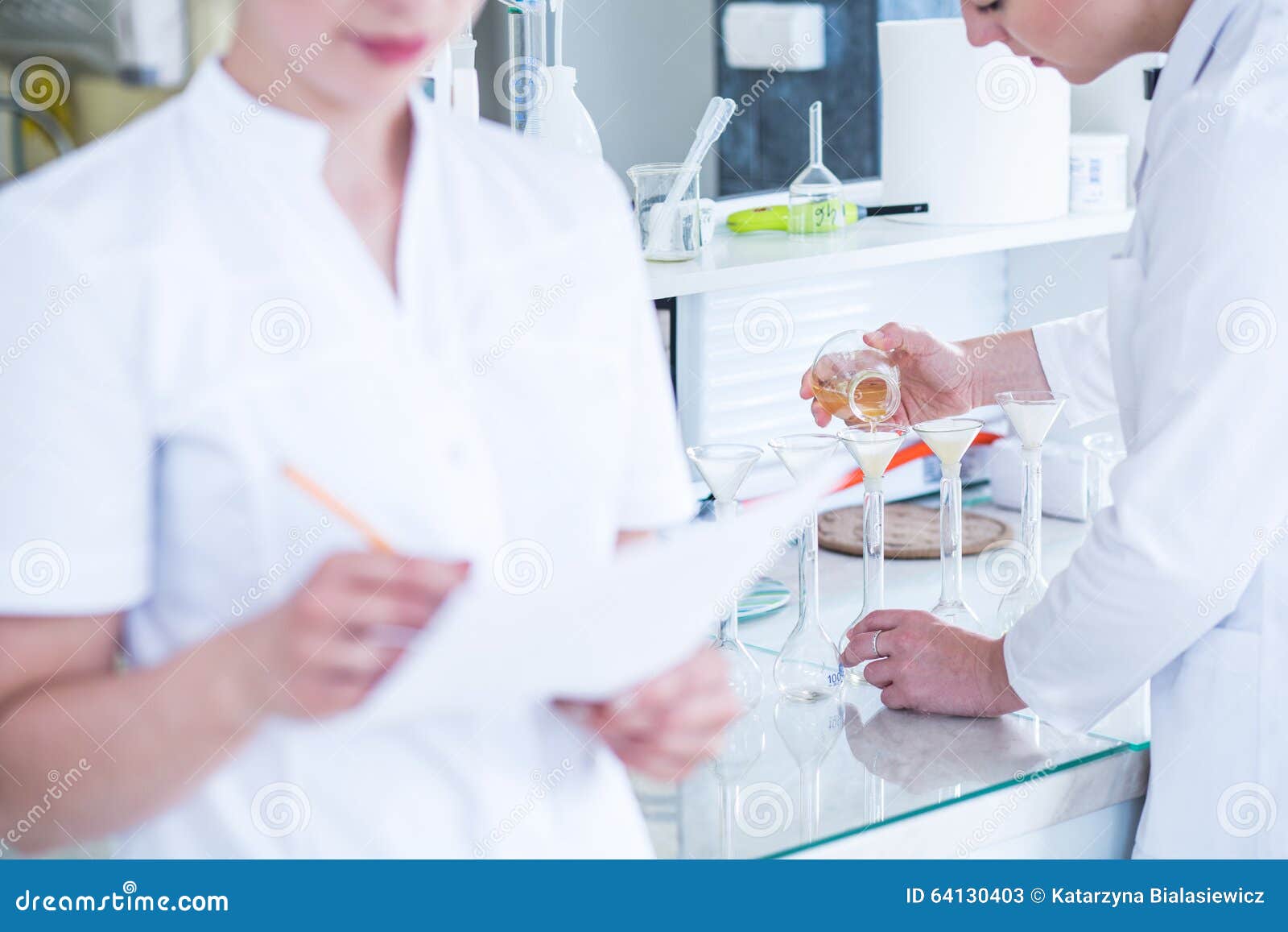 Teamwork in the laboratory stock image. Image of technology - 64130403