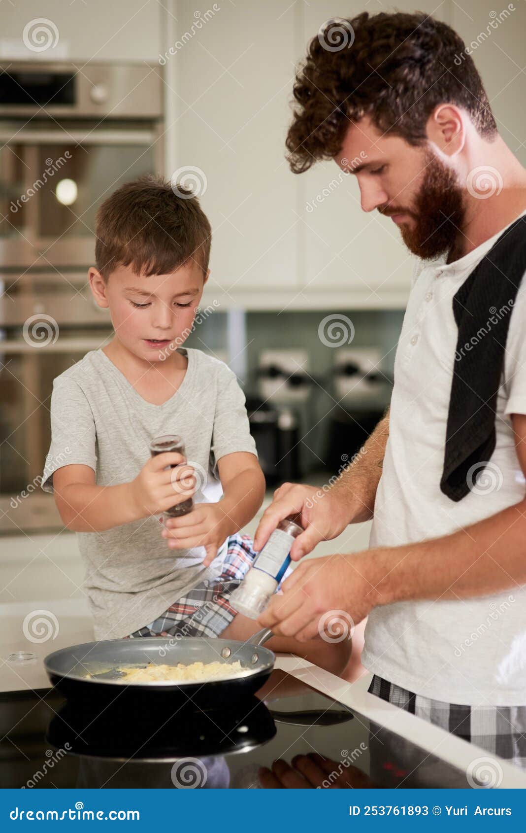 Teamwork Makes Breakfast Work. an Adorable Little Boy and His Father ...