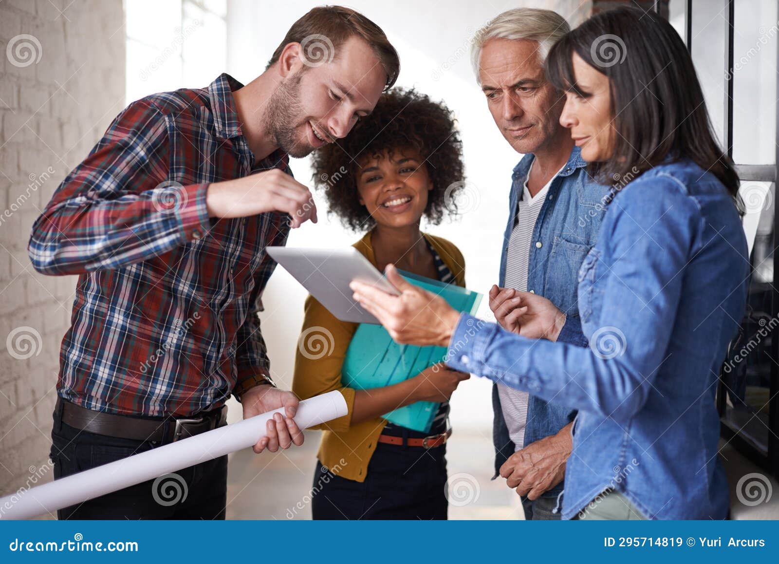 Teamwork Makes the Dream Work. a Group of Co-workers Standing Around a ...