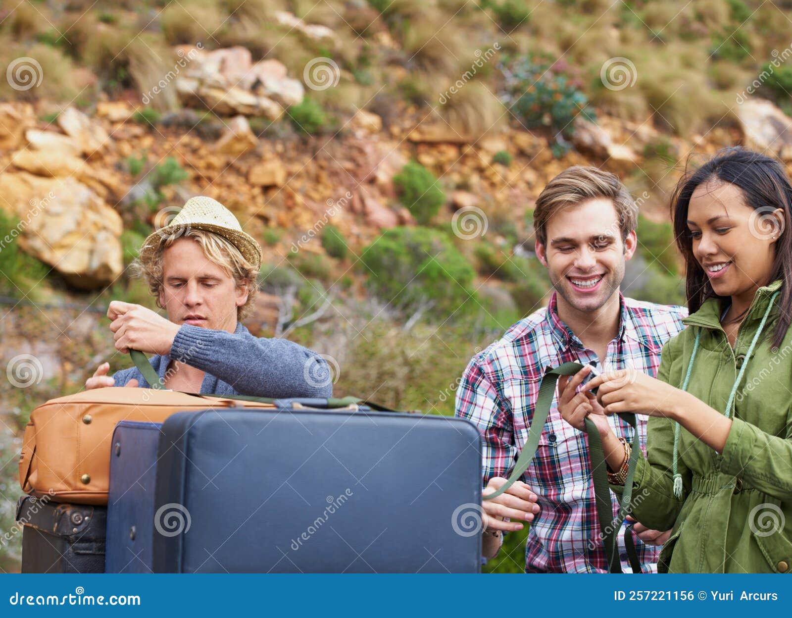 Teamwork Makes it Go Faster. a Group of Young People Unloading Their ...