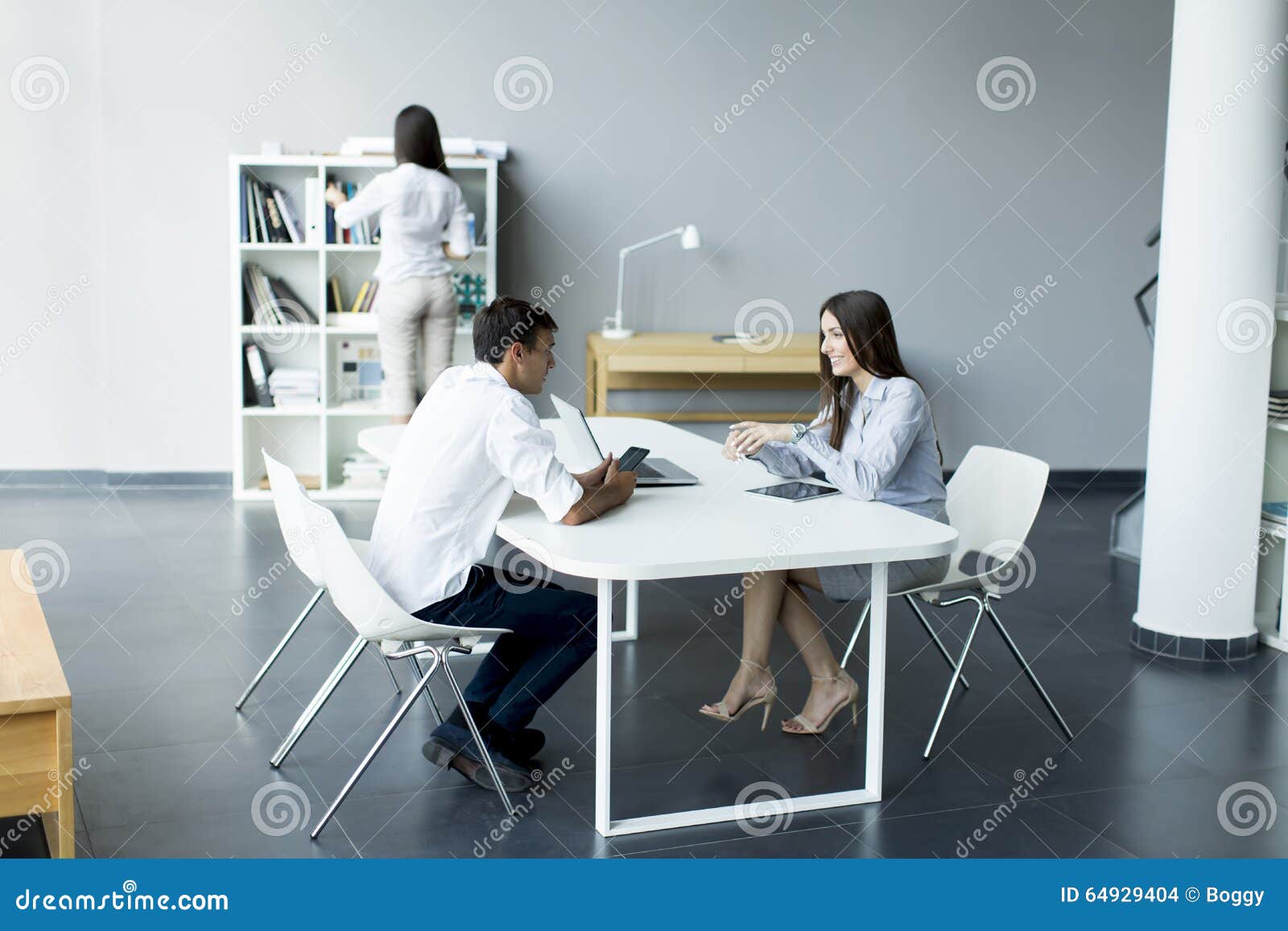 Teamwork in the office stock photo. Image of talking - 64929404
