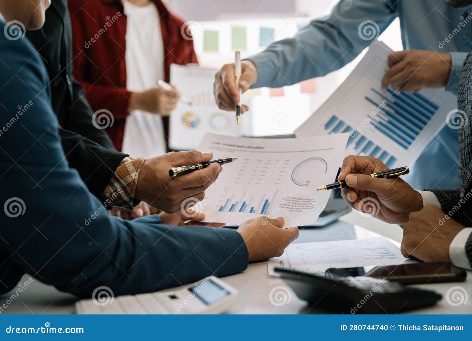 Teamwork Process, Business Team Using a Calculator To Calculate the ...