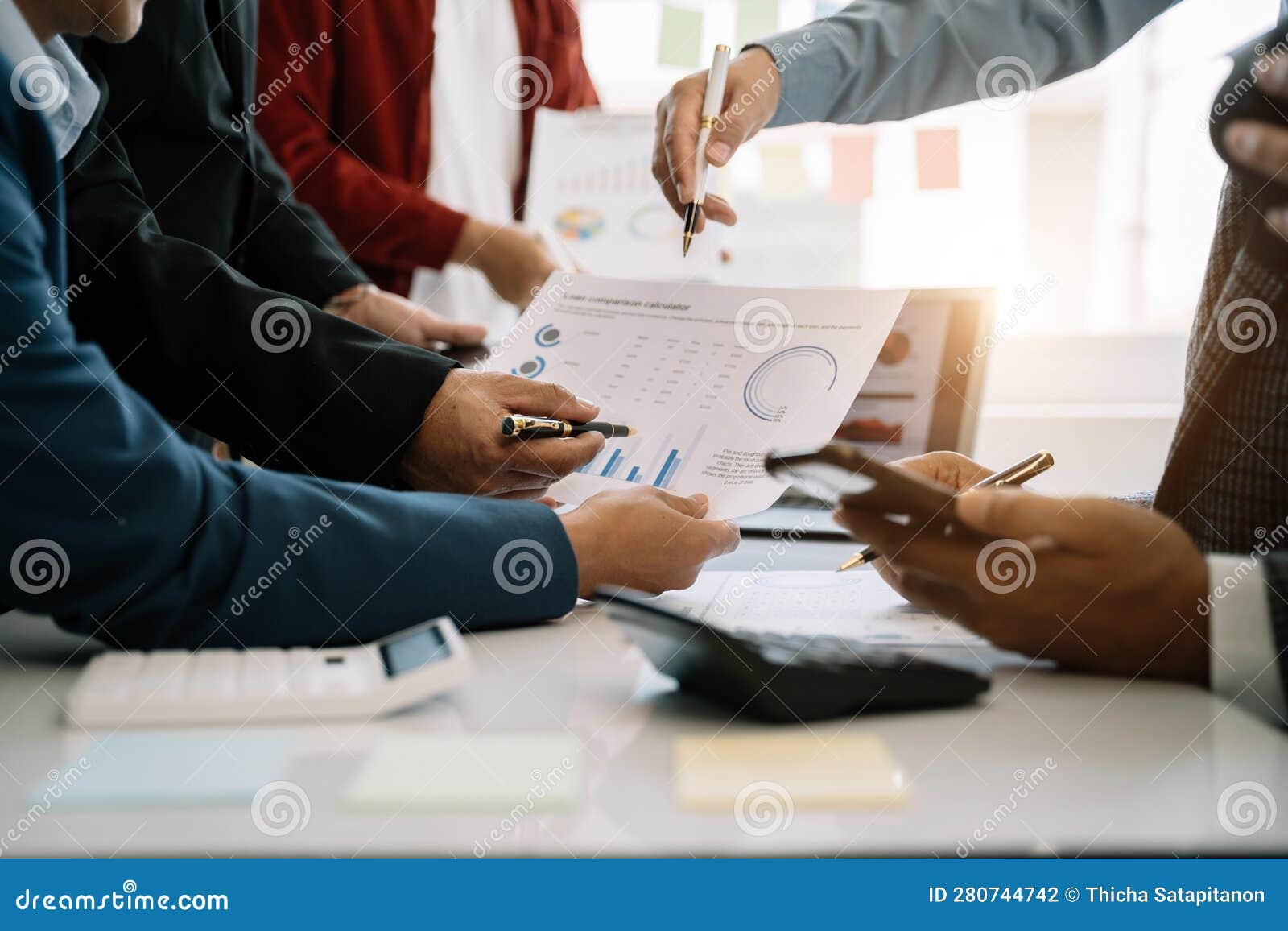 Teamwork Process, Business Team Using a Calculator To Calculate the ...