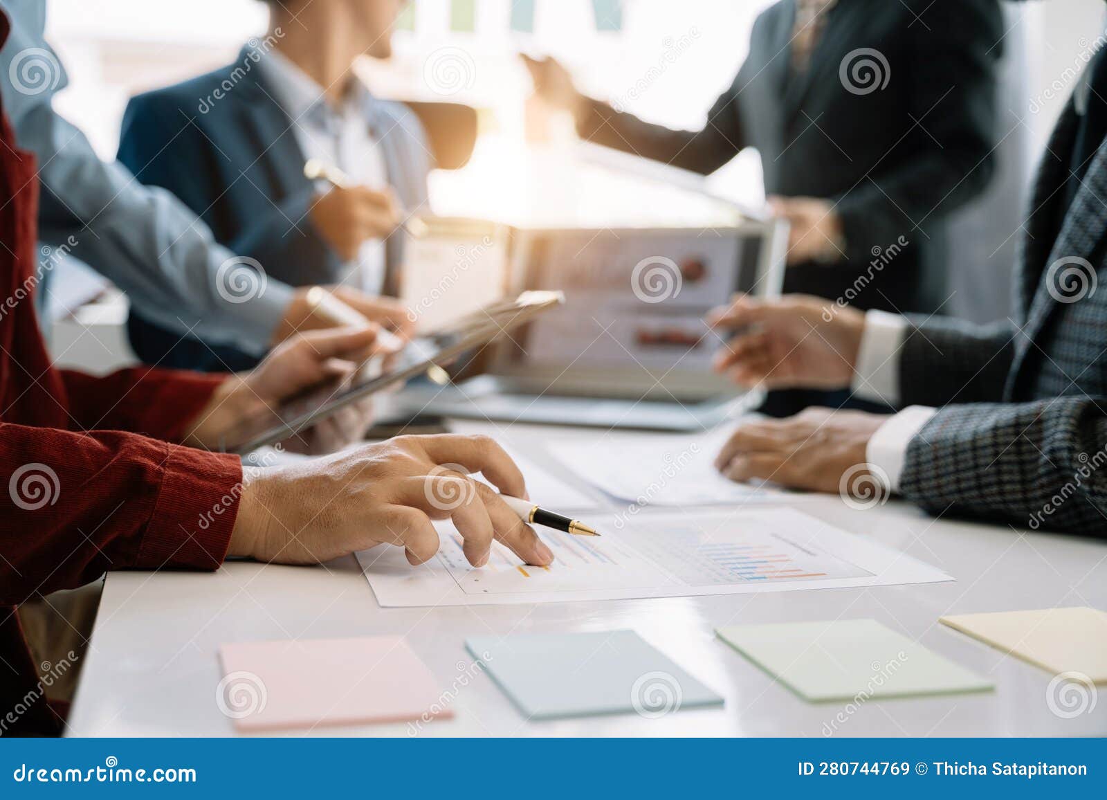 Teamwork Process, Business Team Using a Calculator To Calculate the ...