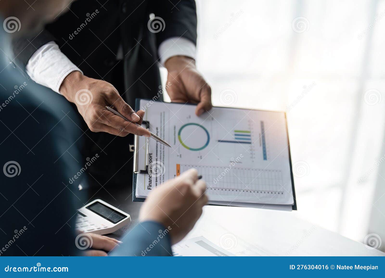Teamwork Process, Business Team Using a Calculator To Calculate the of ...