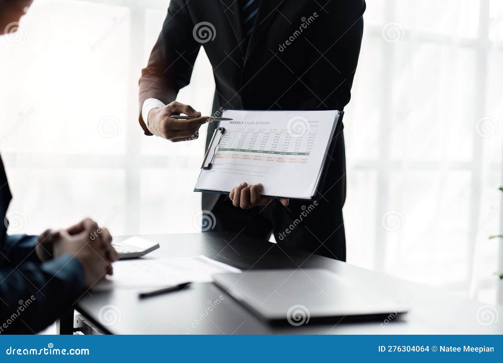 Teamwork Process, Business Team Using a Calculator To Calculate the of ...