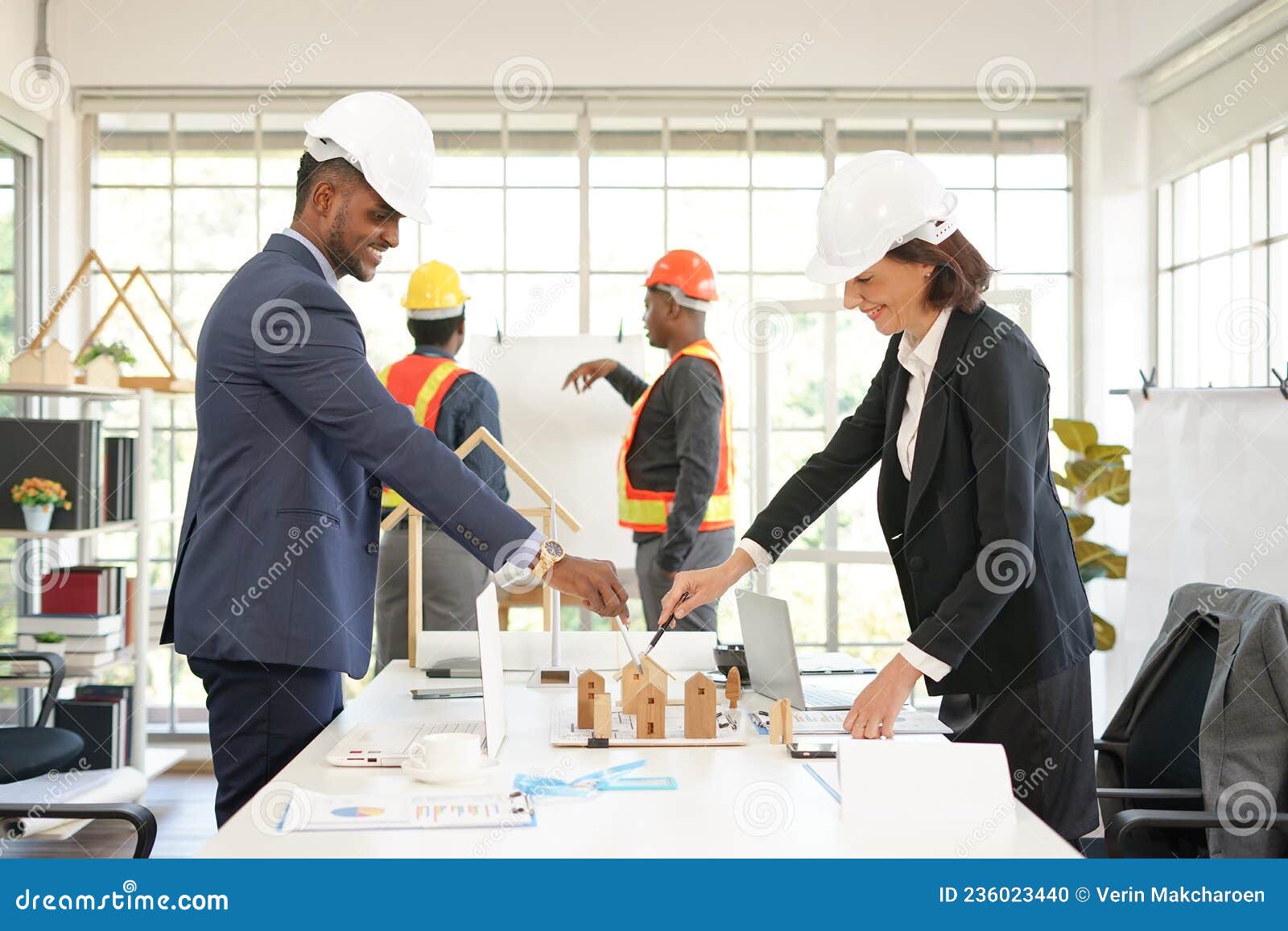 Teamwork and Project Management Engineers Discussing Project Together ...