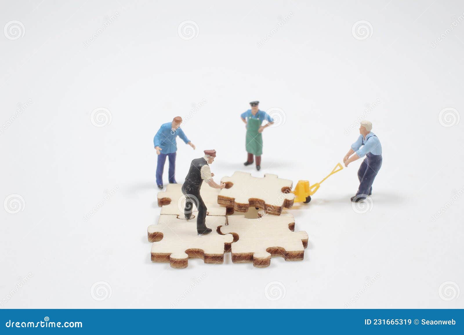 A Teamwork Puzzle Concept, Figure Assembling Jigsaw Puzzle Stock Image ...
