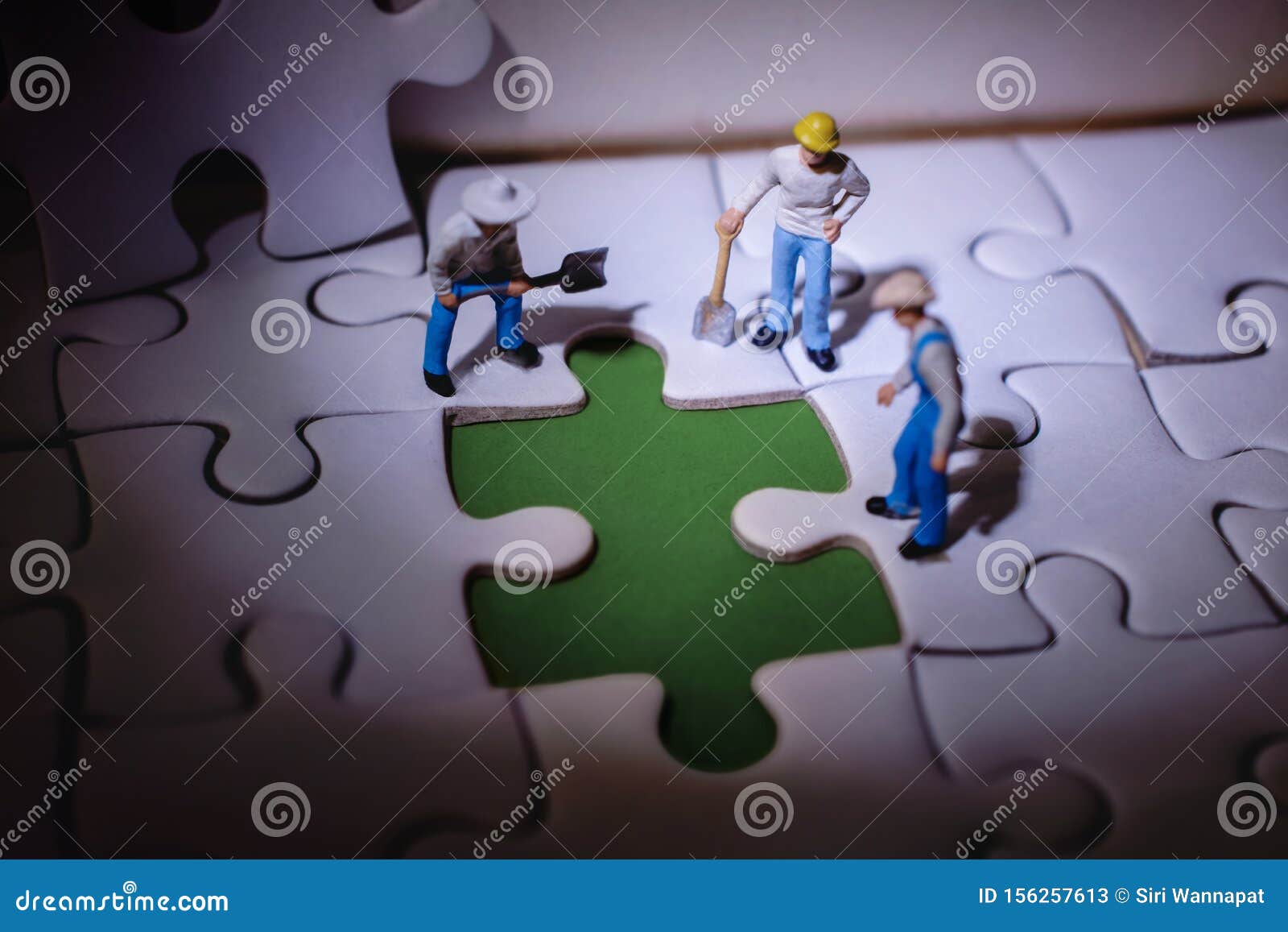 Teamwork and Solving Problem Concept. Group of Miniature Worker Men ...