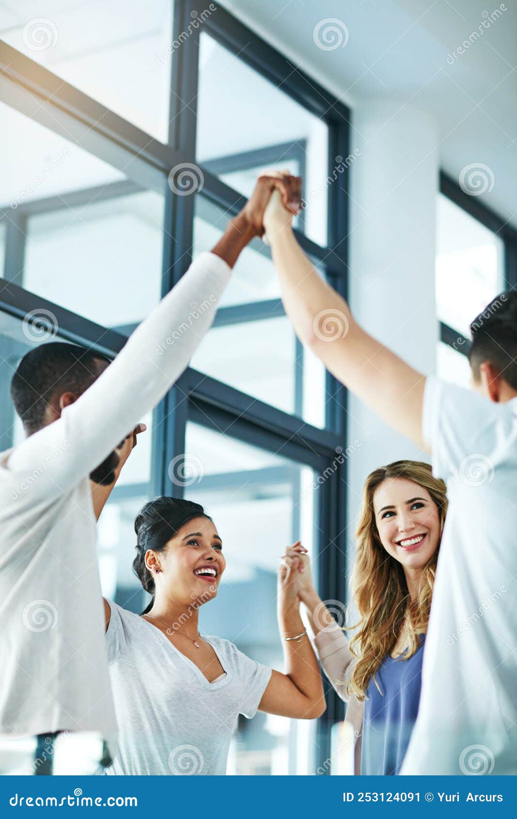 Teamwork, Support and Fun at Work with a Happy Group of Business People ...