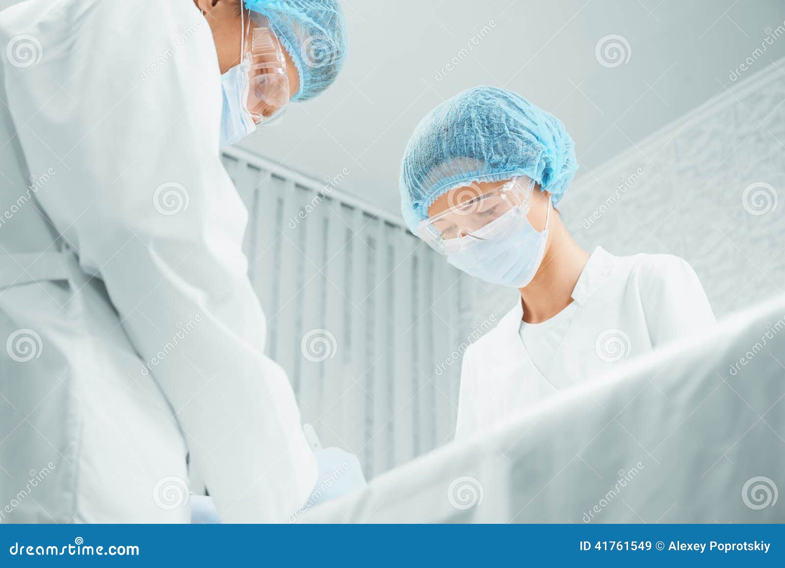 Teamwork surgeons stock image. Image of female, operating - 41761549