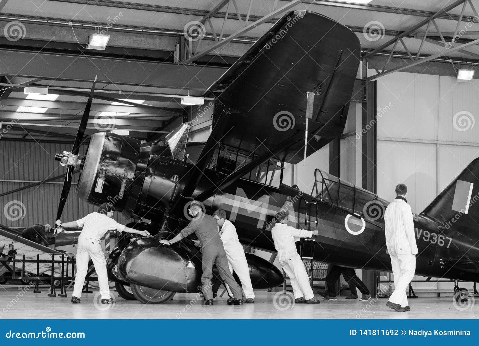 Teamwork editorial photography. Image of hangar, teamwork - 141811692