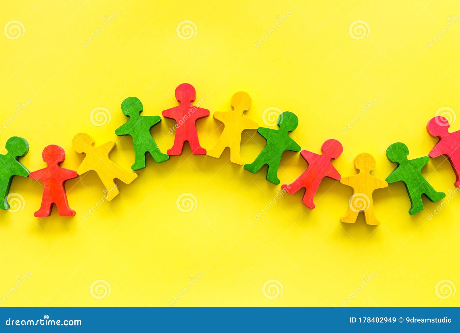 Teamwork, Teambuilding Concept. Wooden Figures of People on Yellow ... Teamwork, Teambuilding Concept. Wooden Figures of People on Yellow ...